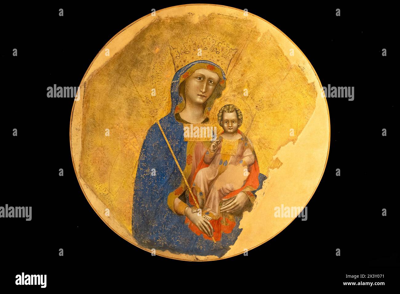 Close-up on round medieval painting of Virgin Mary dressed as a queen ...