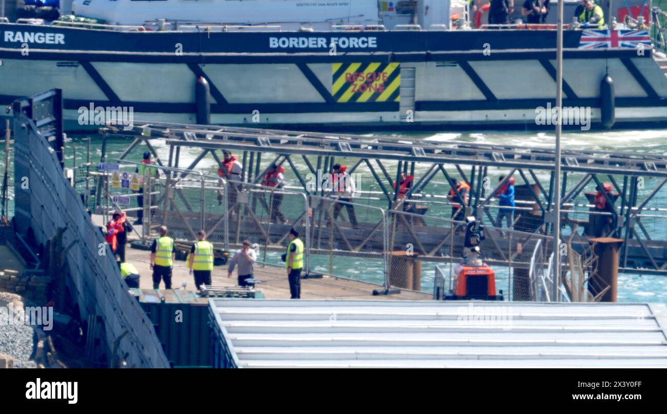 A group of people thought to be migrants are brought in to Dover, Kent ...