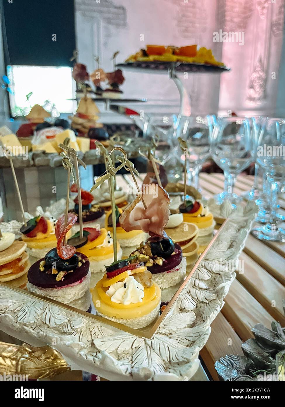 Catering buffet with sweet and savory appetizers, fruit platter with ...