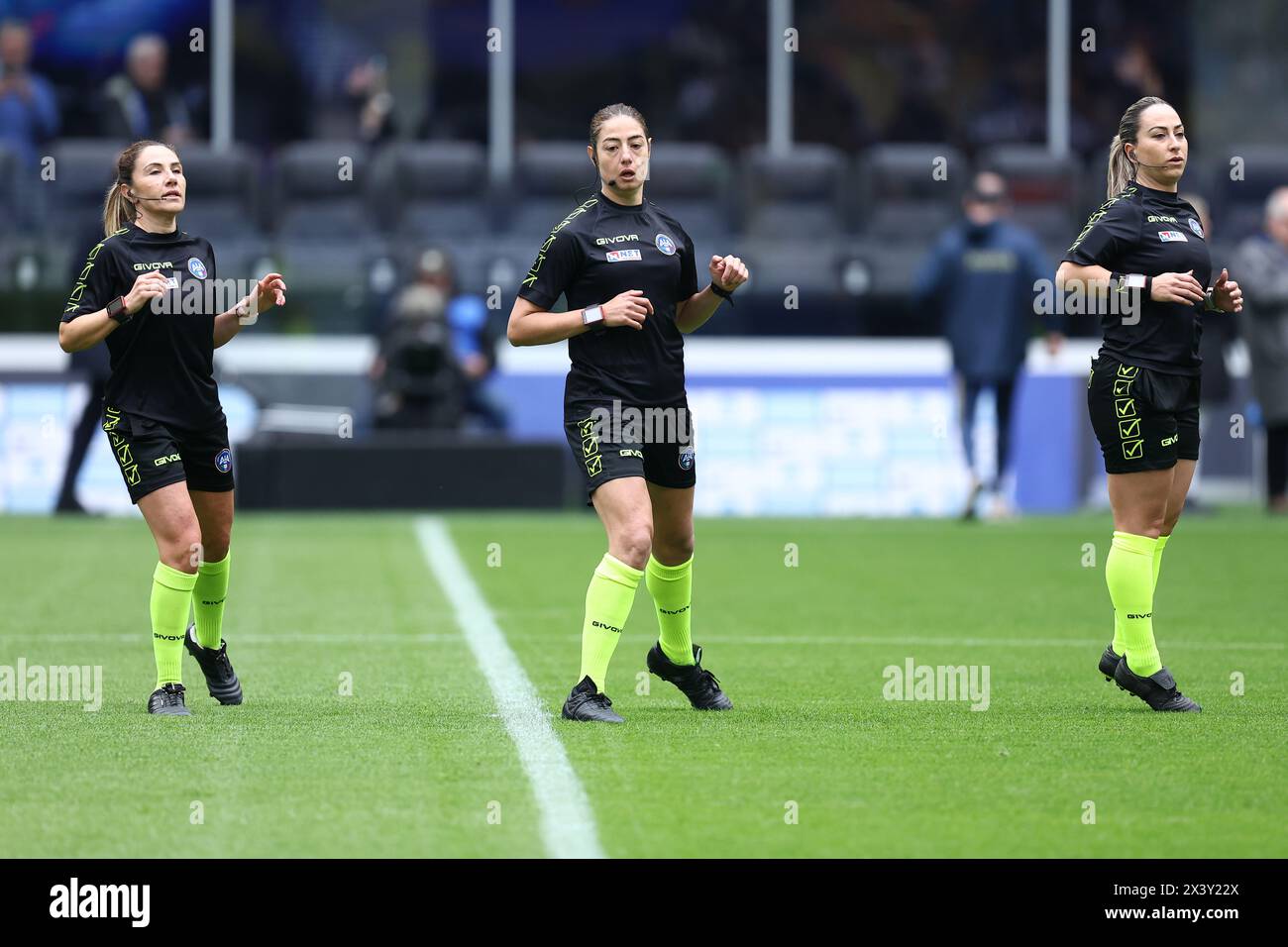 Referee Maria Sole Ferrieri Caputi (C) warms up with Assistant referee ...