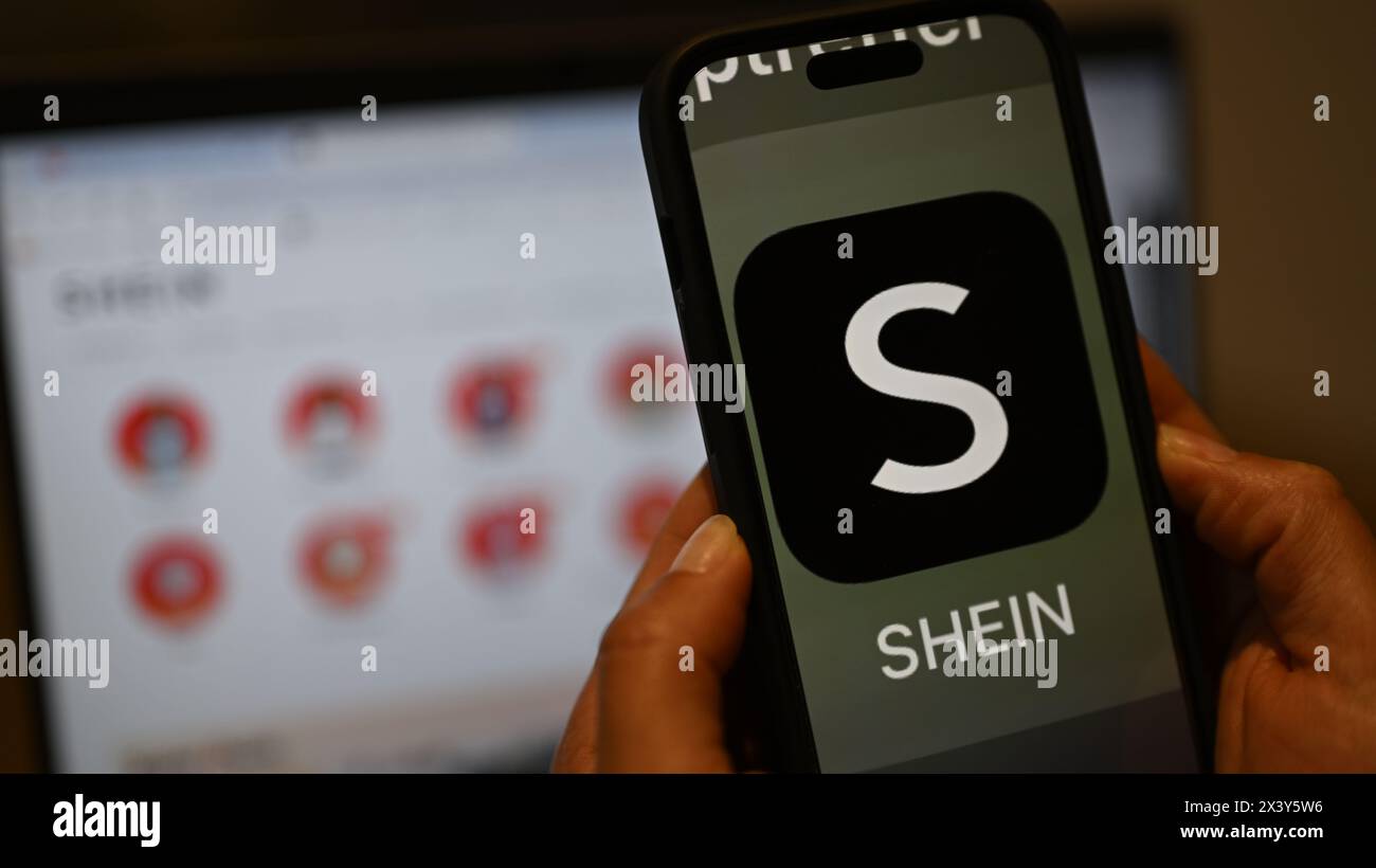 29 April 2024, Berlin: The Shein logo can be seen on a smartphone ...