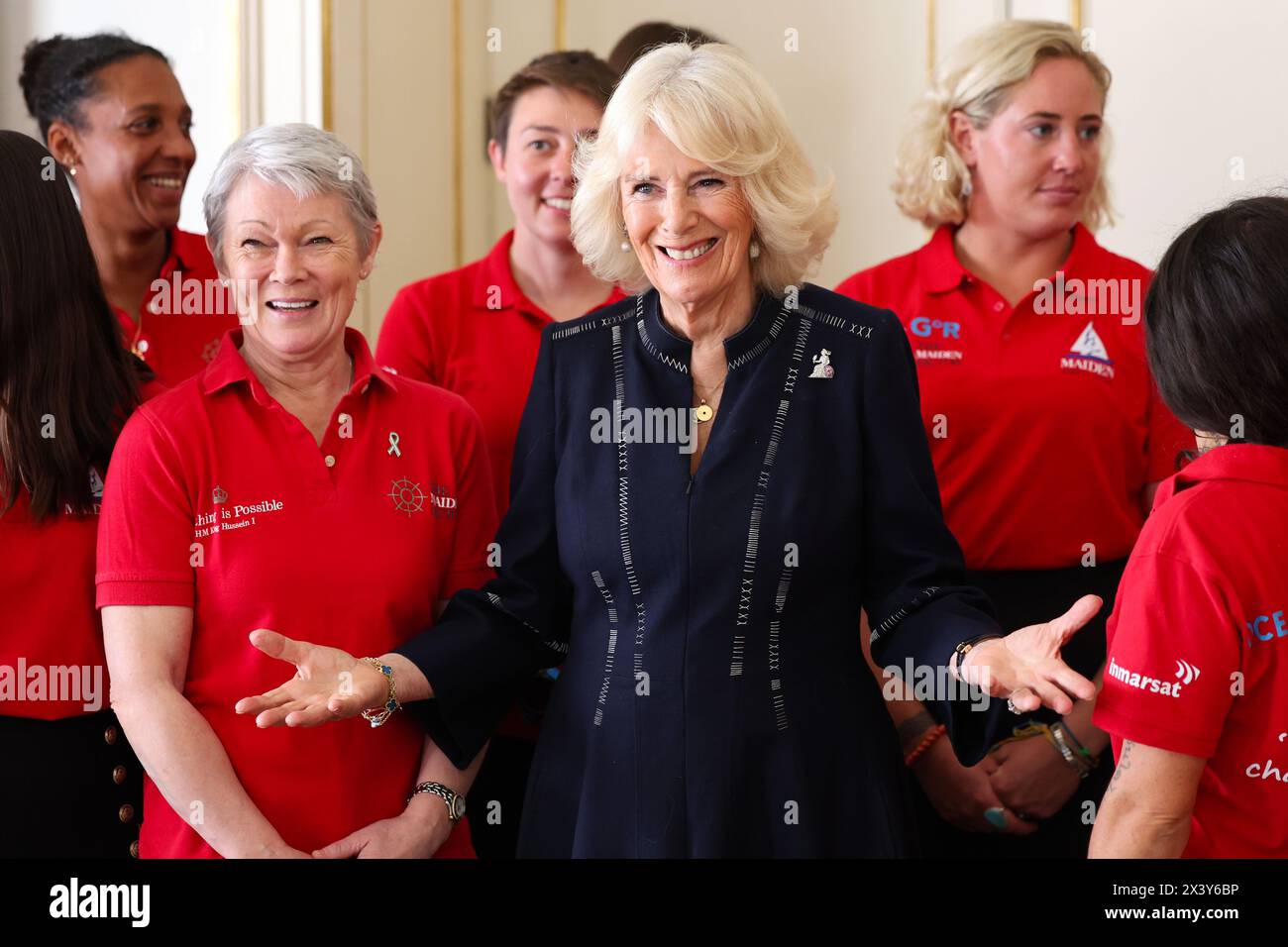 Queen Camilla, speaks to crew members as she hosts a reception for the ...