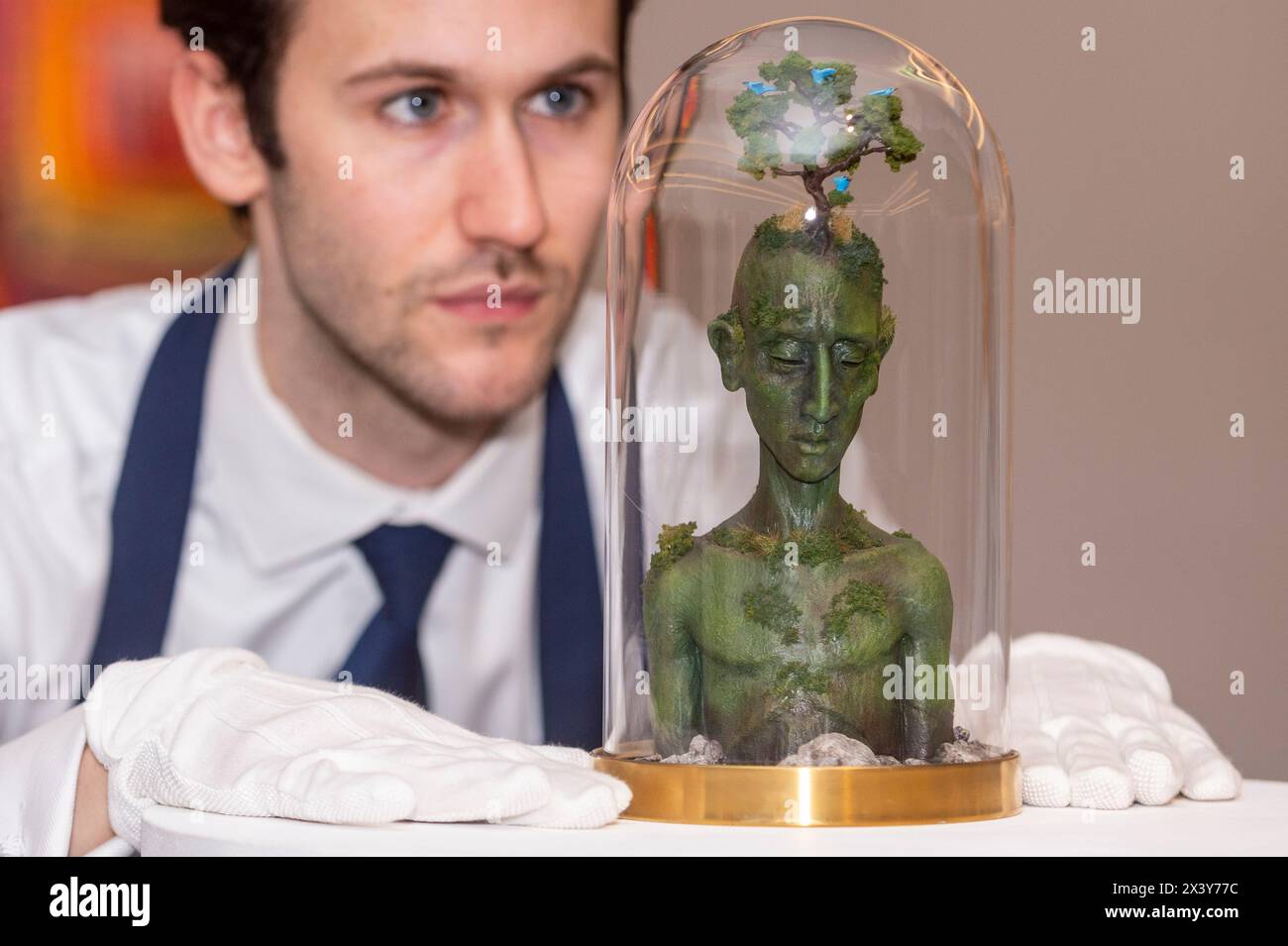 London, UK. 29 April 2024. A staff member with artist Tom Astley's 'No ...