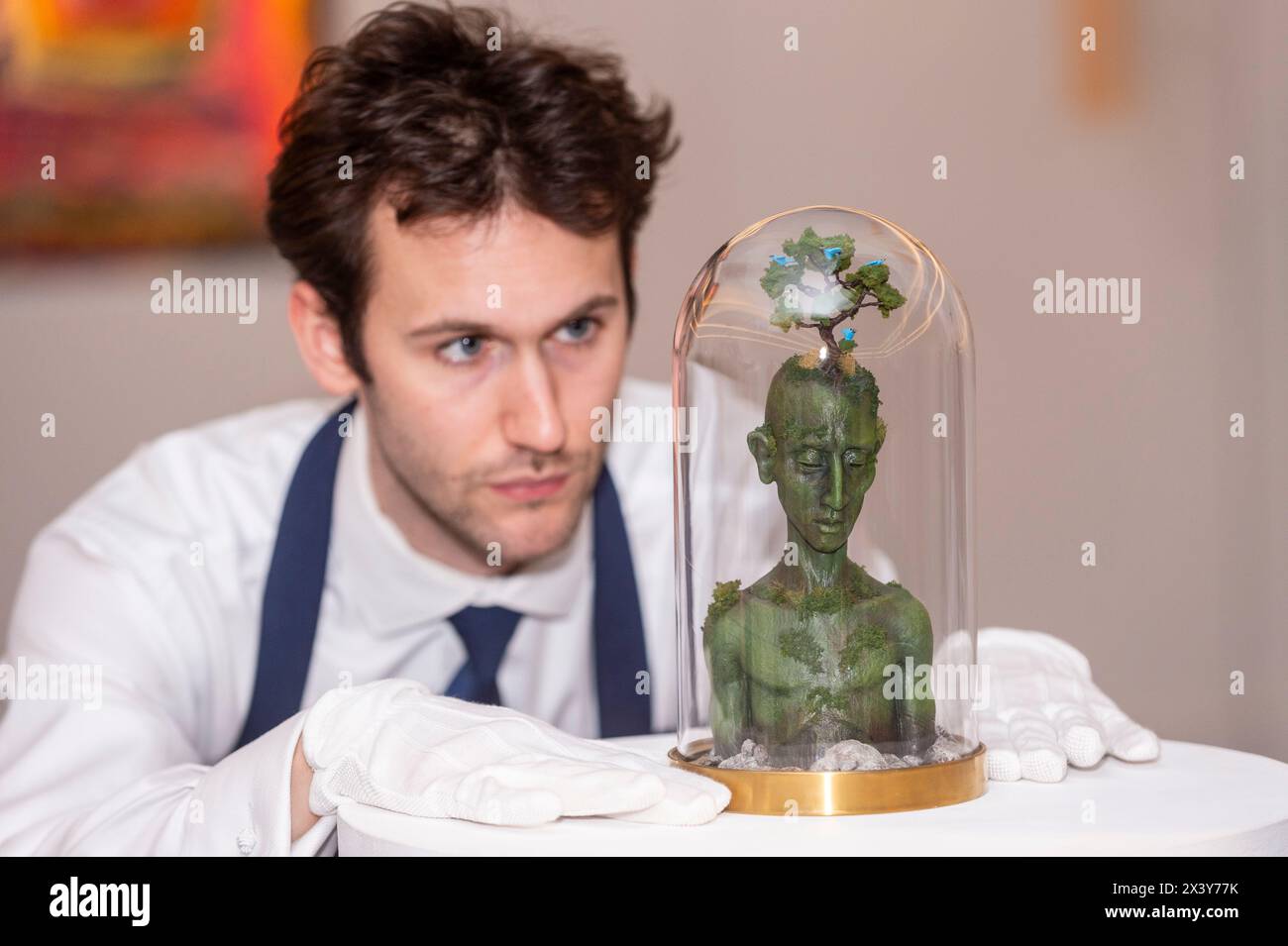 London, UK. 29 April 2024. A staff member with artist Tom Astley's 'No ...