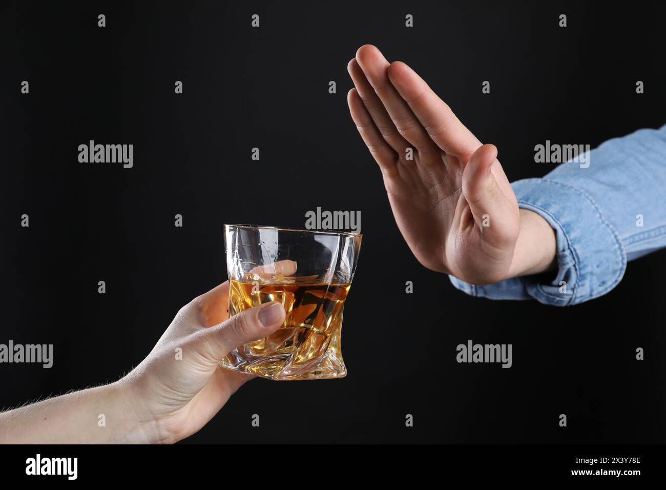 Alcohol addiction. Man refusing glass of whiskey on dark background ...