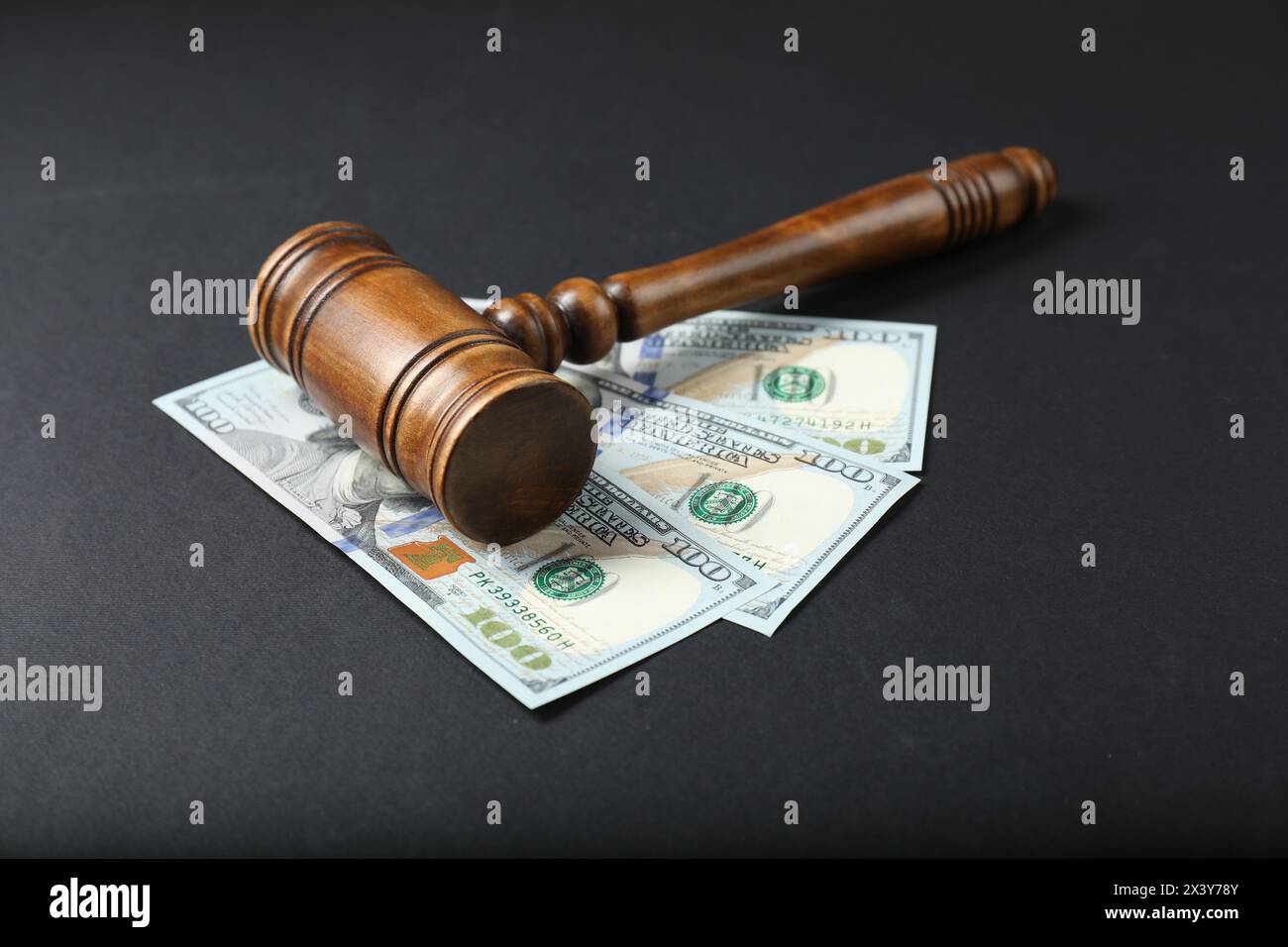 Law gavel on dollars hi-res stock photography and images - Alamy