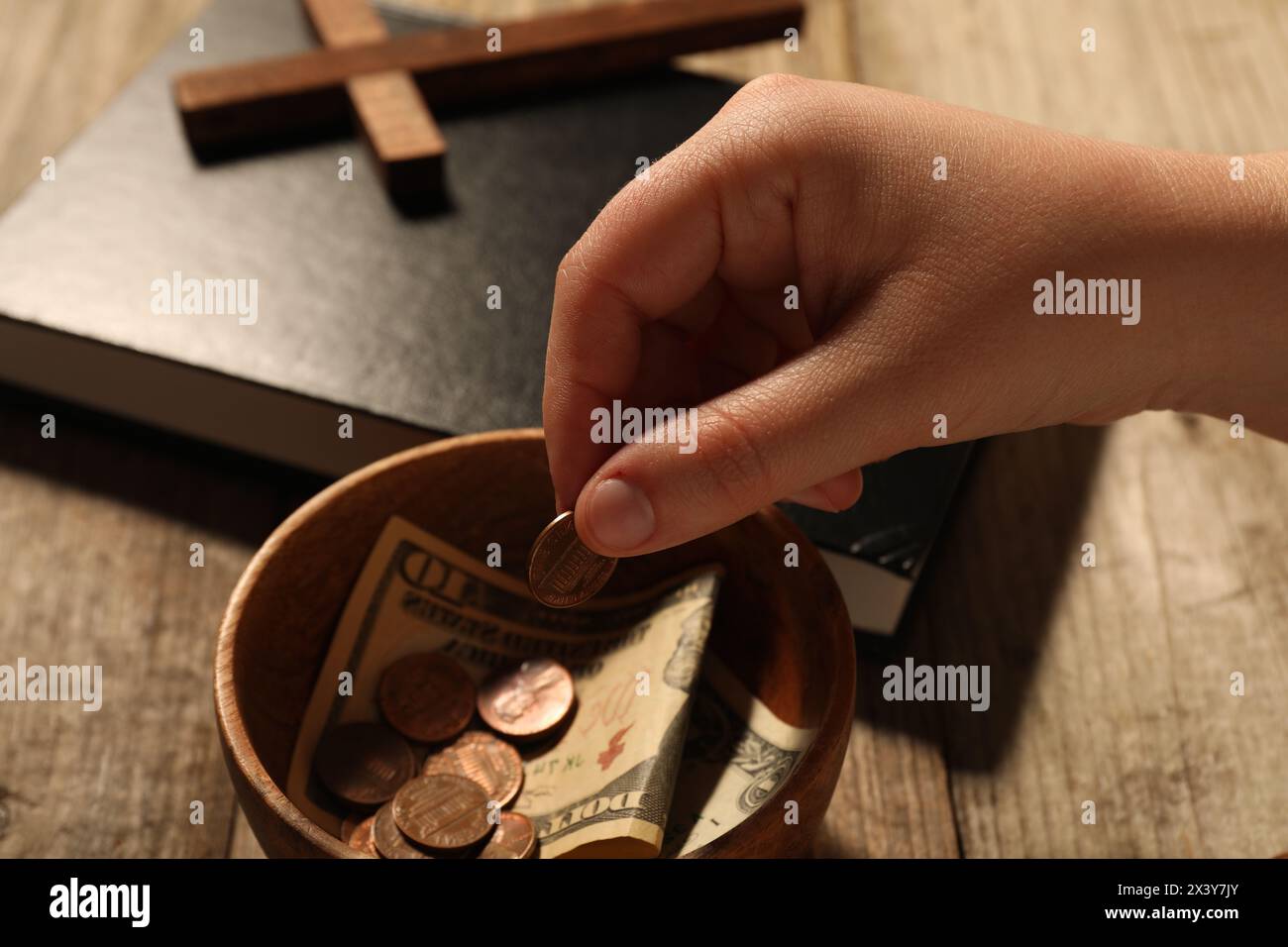 Donate and give concept. Woman putting coin into bowl with money at ...
