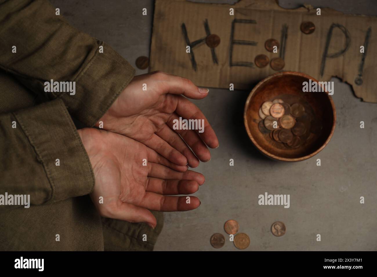 Poor homeless woman begging for money. Cardboard help sign and bowl ...