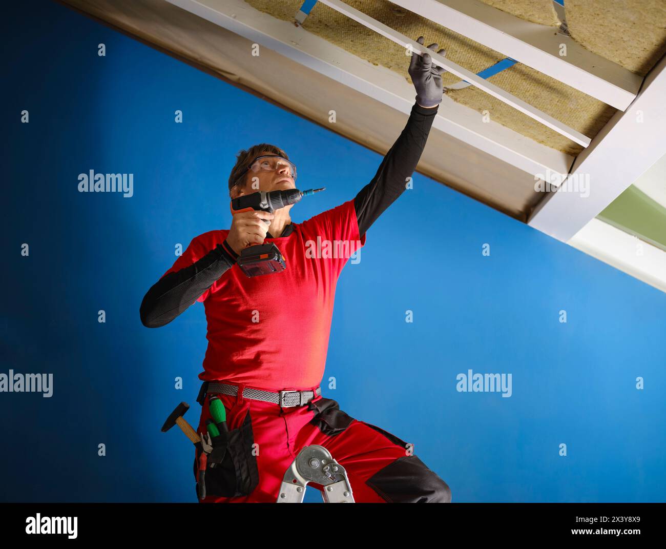 Rock wool applied to a wooden attic under renovation to save energy ...