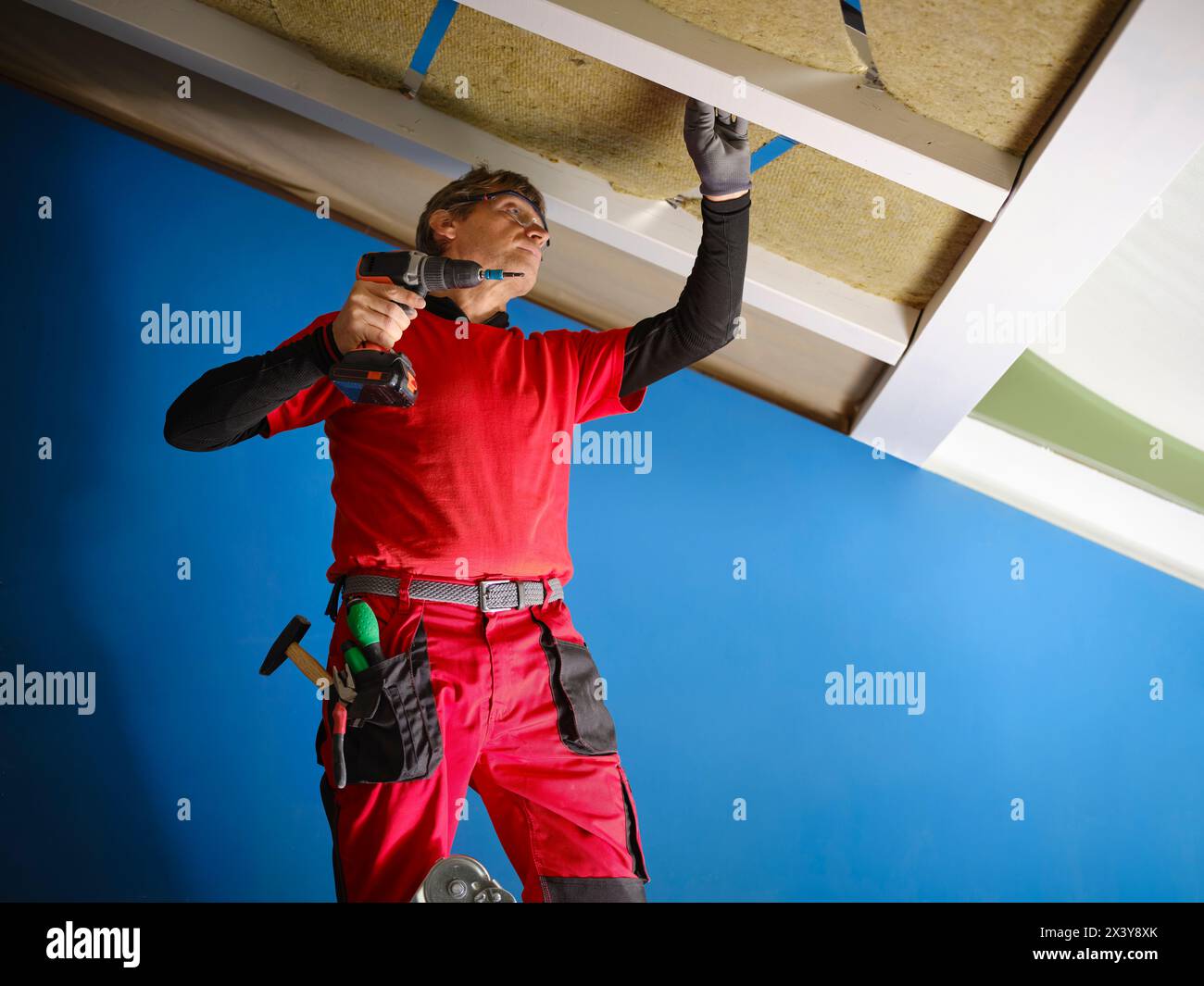 Rock wool applied to a wooden attic under renovation to save energy ...