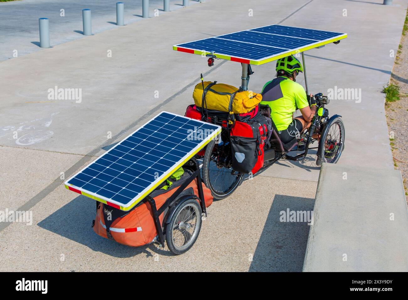 Traveler with tricycle with trailer equipped with solar panels Stock ...