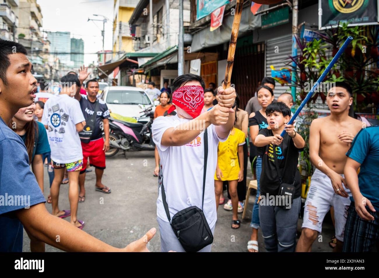 Filipino children play street games together during an annual religious ...