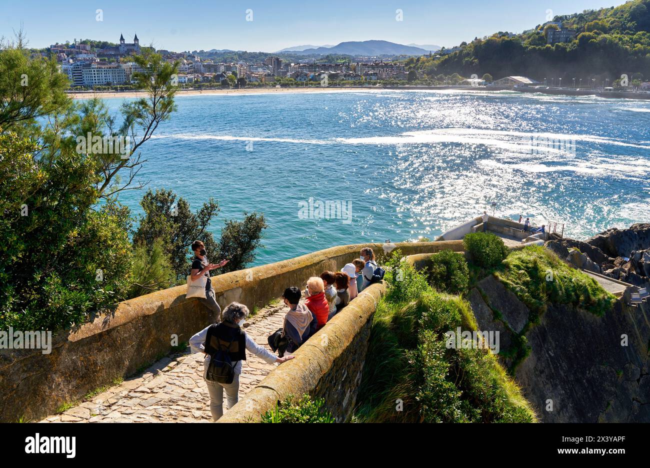 Group of tourists attending the explanations of a guide on Santa Clara ...