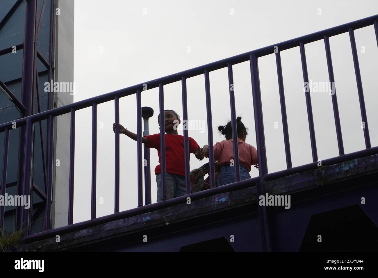 Children playing on the pedestrian bridge in the afternoon Stock Photo ...
