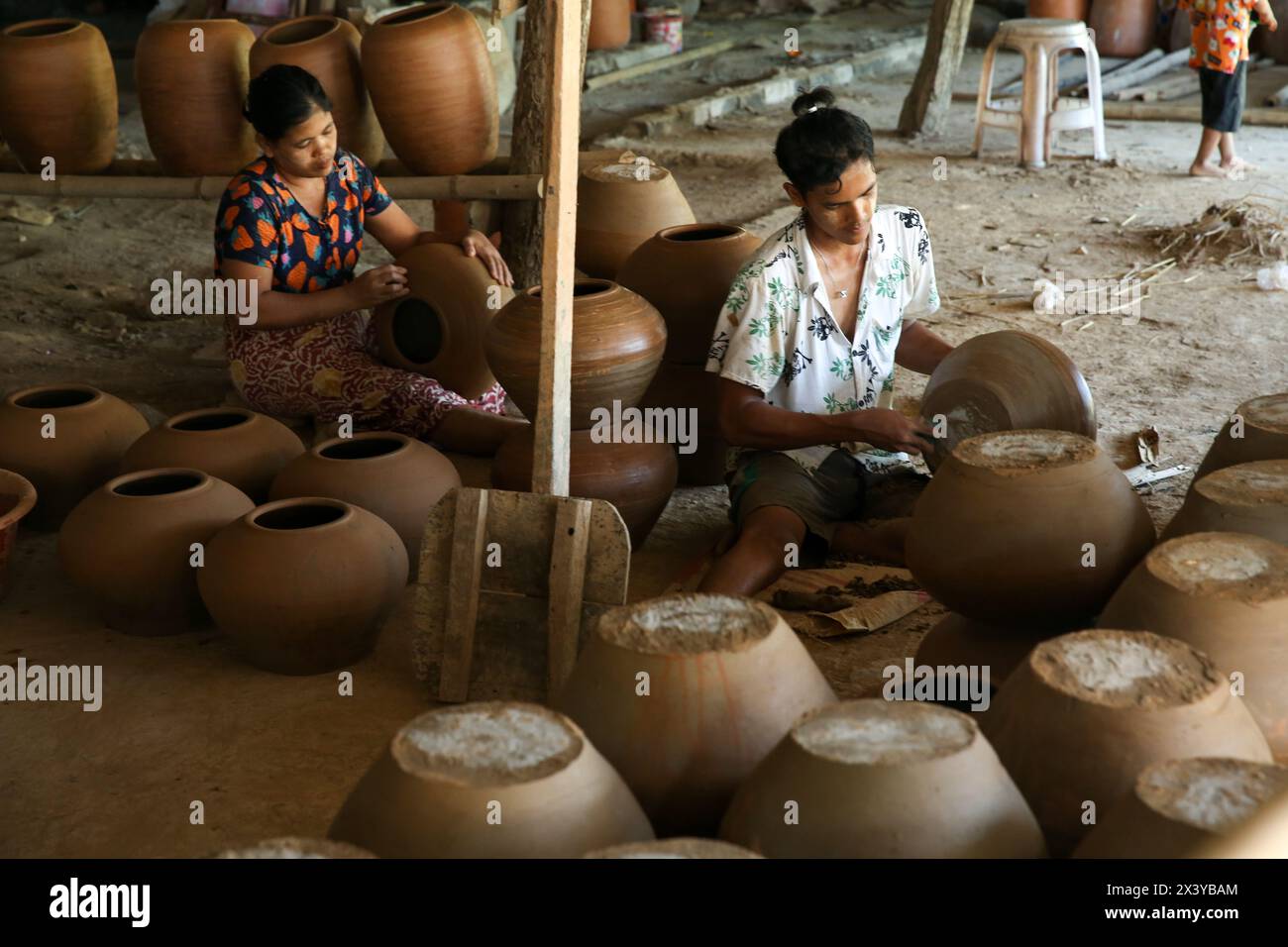 Yangon, Myanmar. 29th Apr, 2024. Potters work at a workshop in Twante ...
