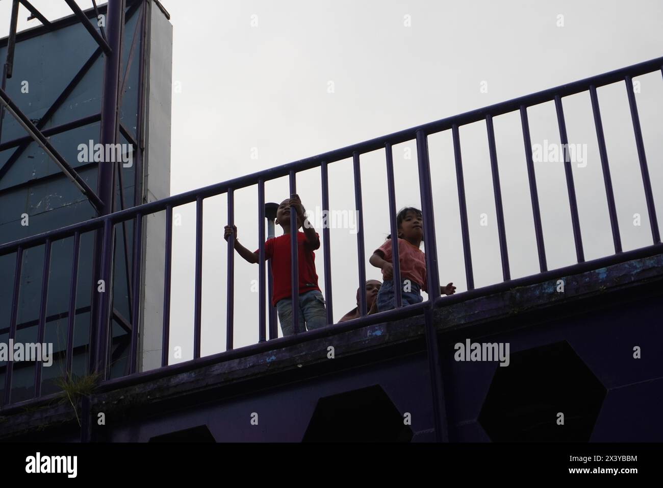 Children playing on the pedestrian bridge in the afternoon Stock Photo ...
