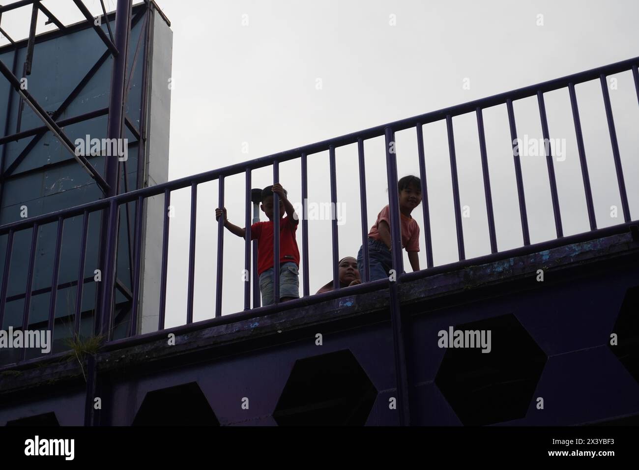Children playing on the pedestrian bridge in the afternoon Stock Photo ...