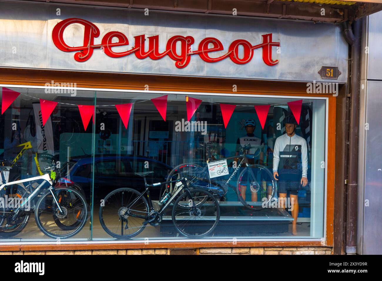 Peugeot two-wheeler sign Stock Photo - Alamy