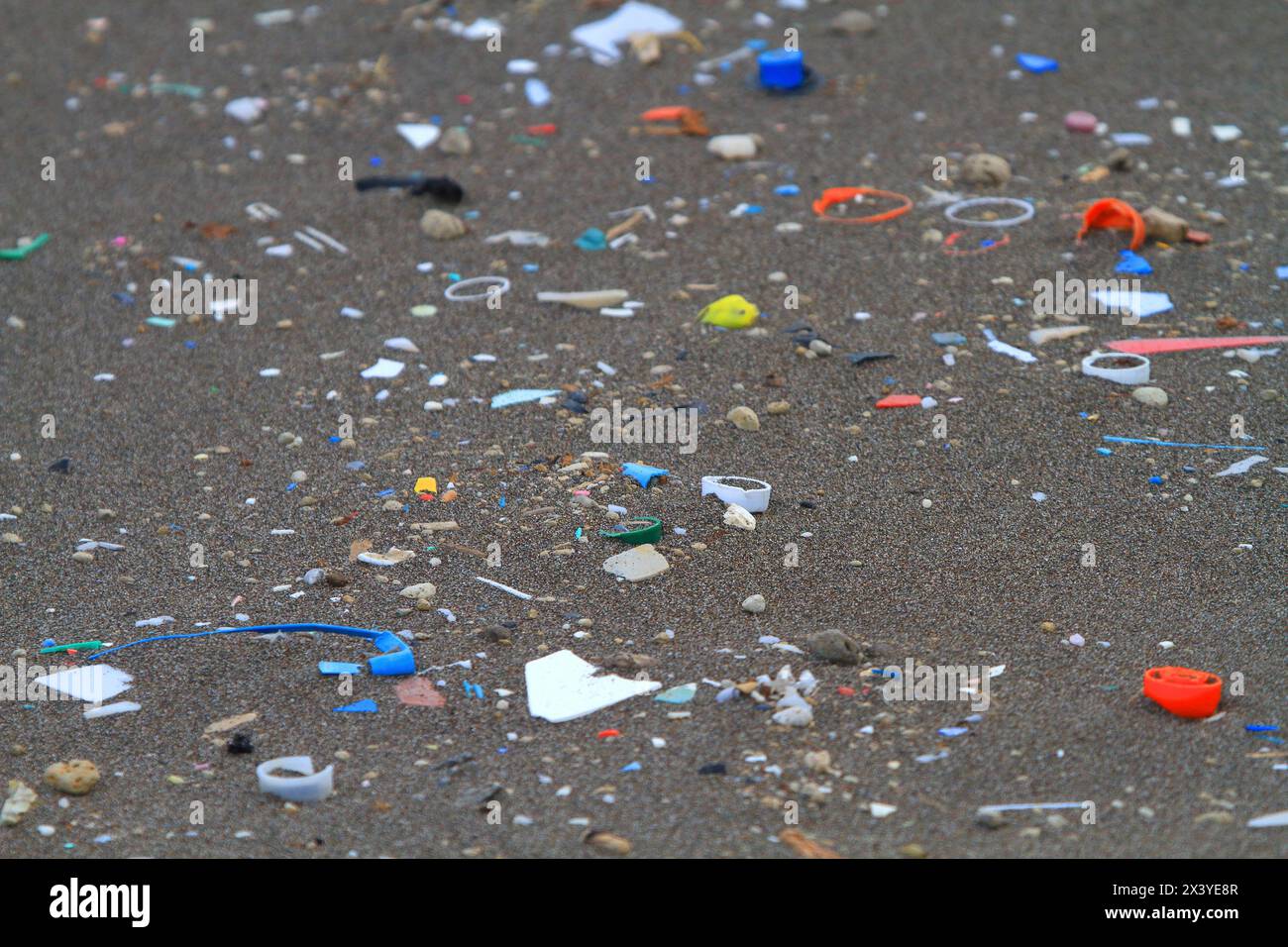 Plastic trash on a beach Stock Photo - Alamy
