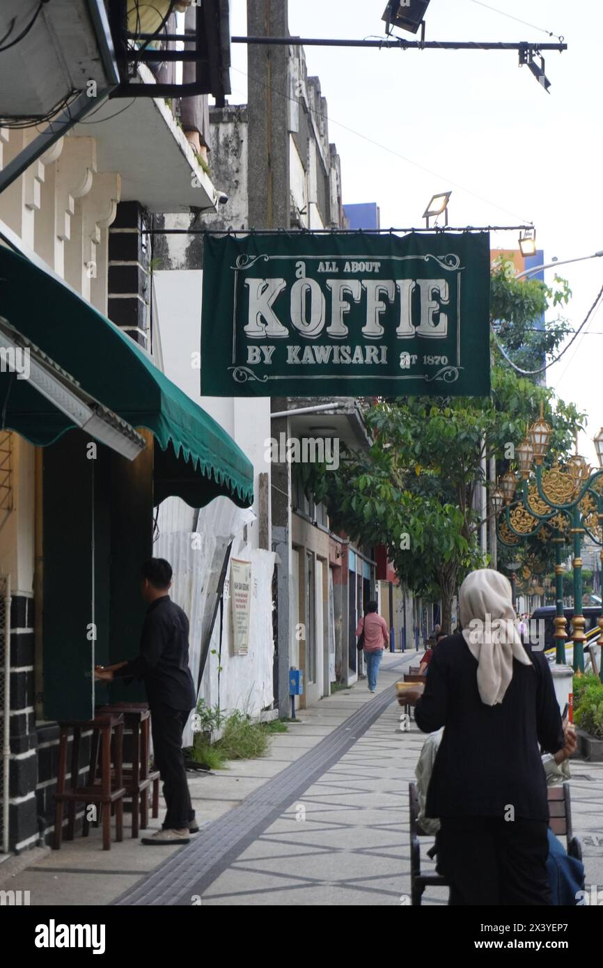 Coffee sign on the side of the road with vintage buildings Stock Photo ...