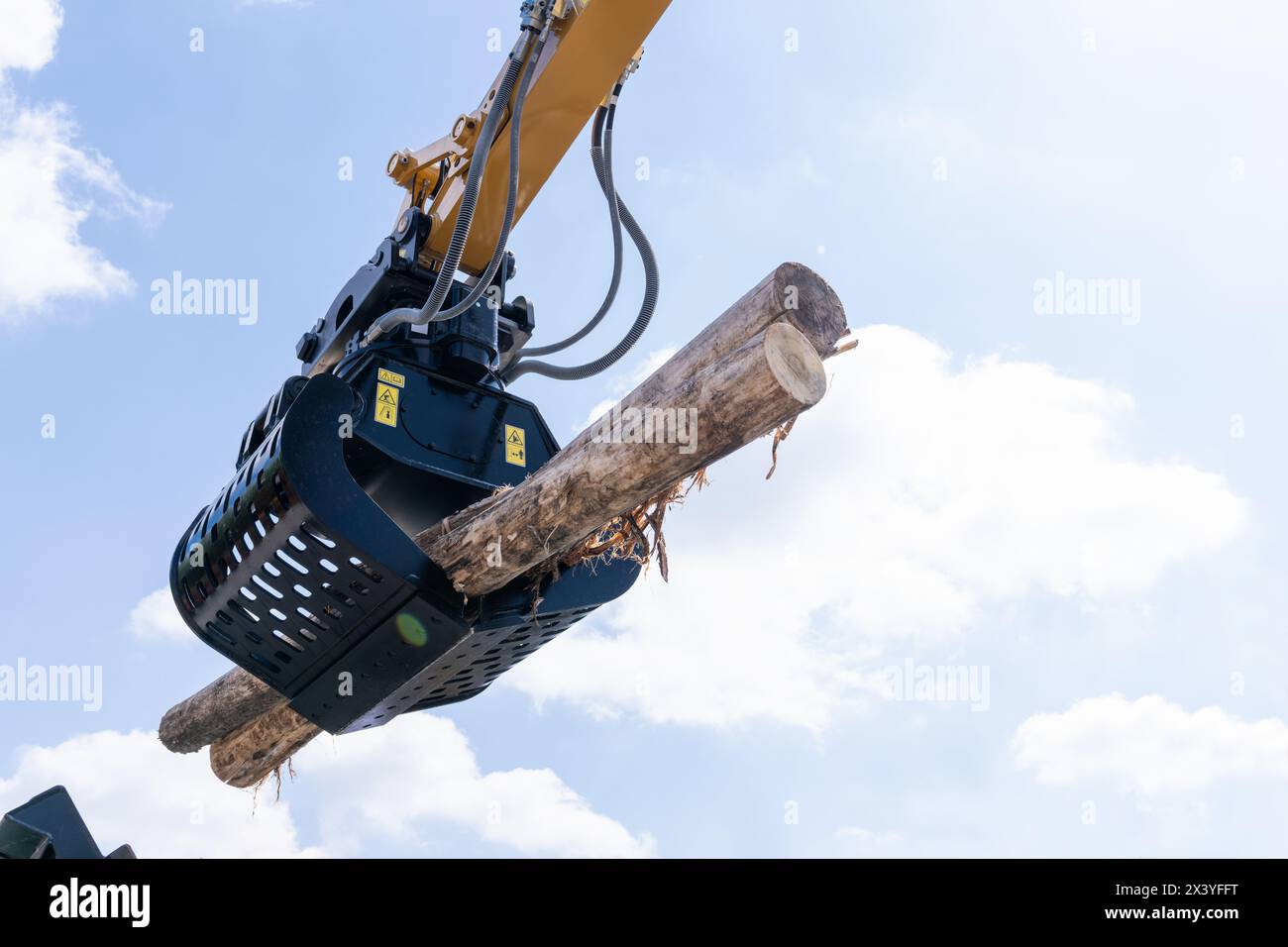 Loading of timber. Loader close up Stock Photo - Alamy