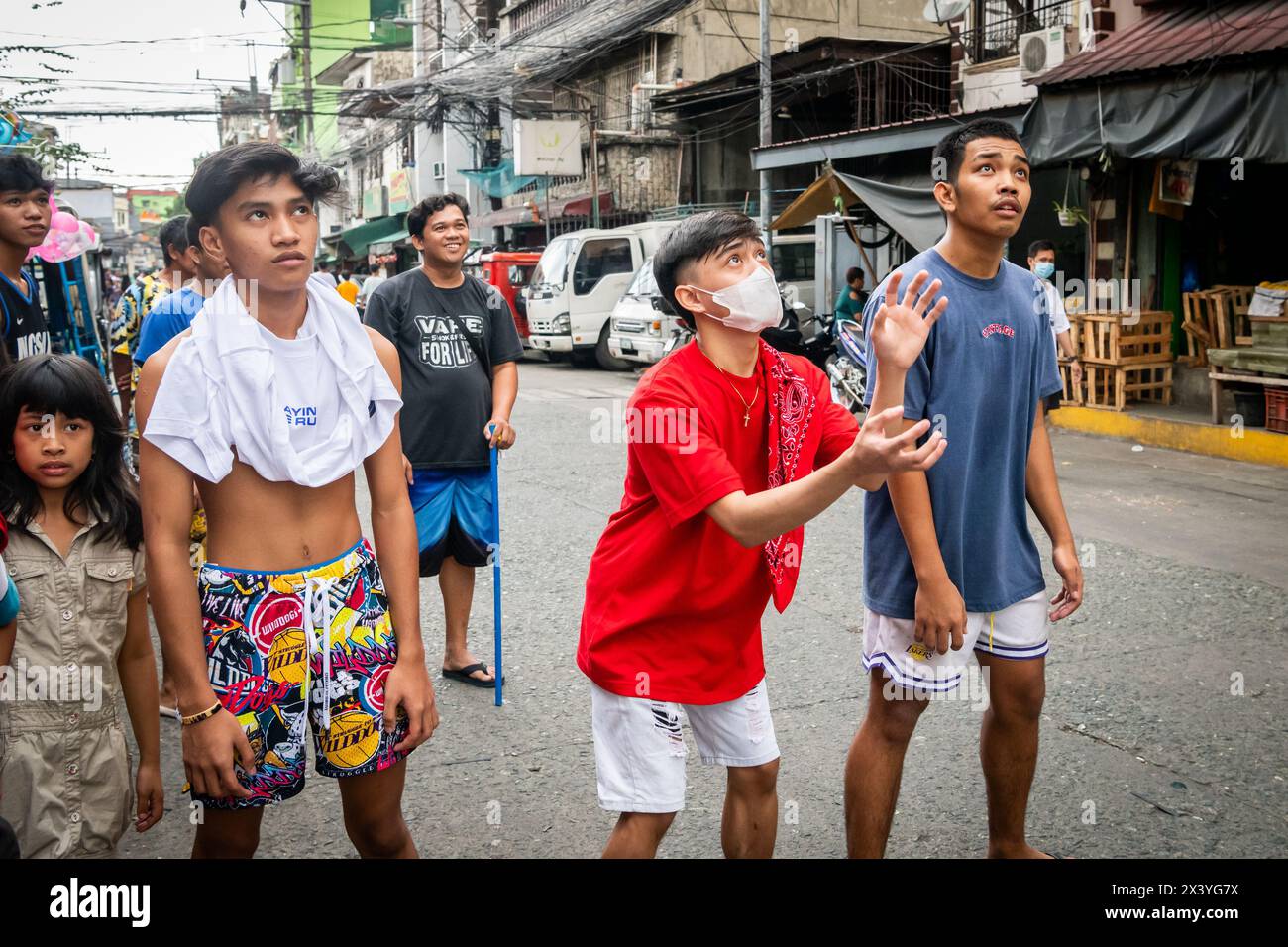 Filipino children play street games together during an annual religious ...
