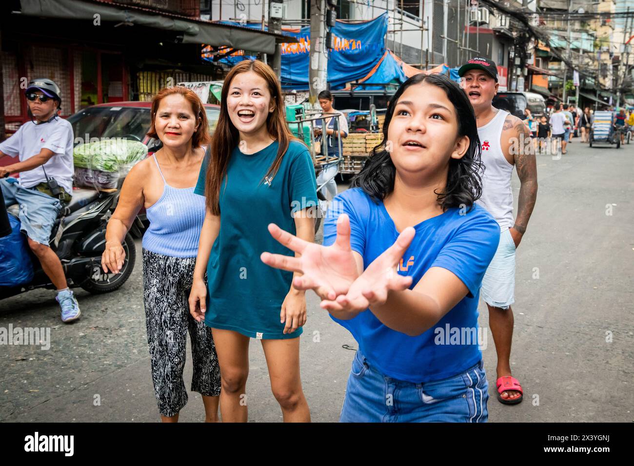 Filipino children play street games together during an annual religious ...
