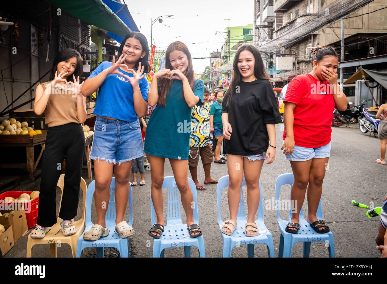 Filipino children play street games together during an annual religious ...