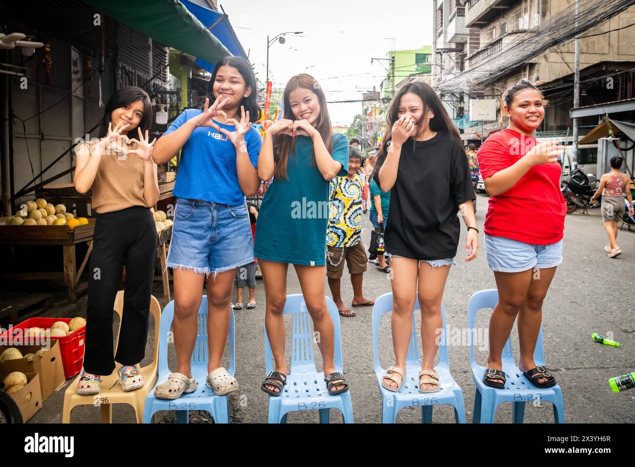 Filipino children play street games together during an annual religious ...