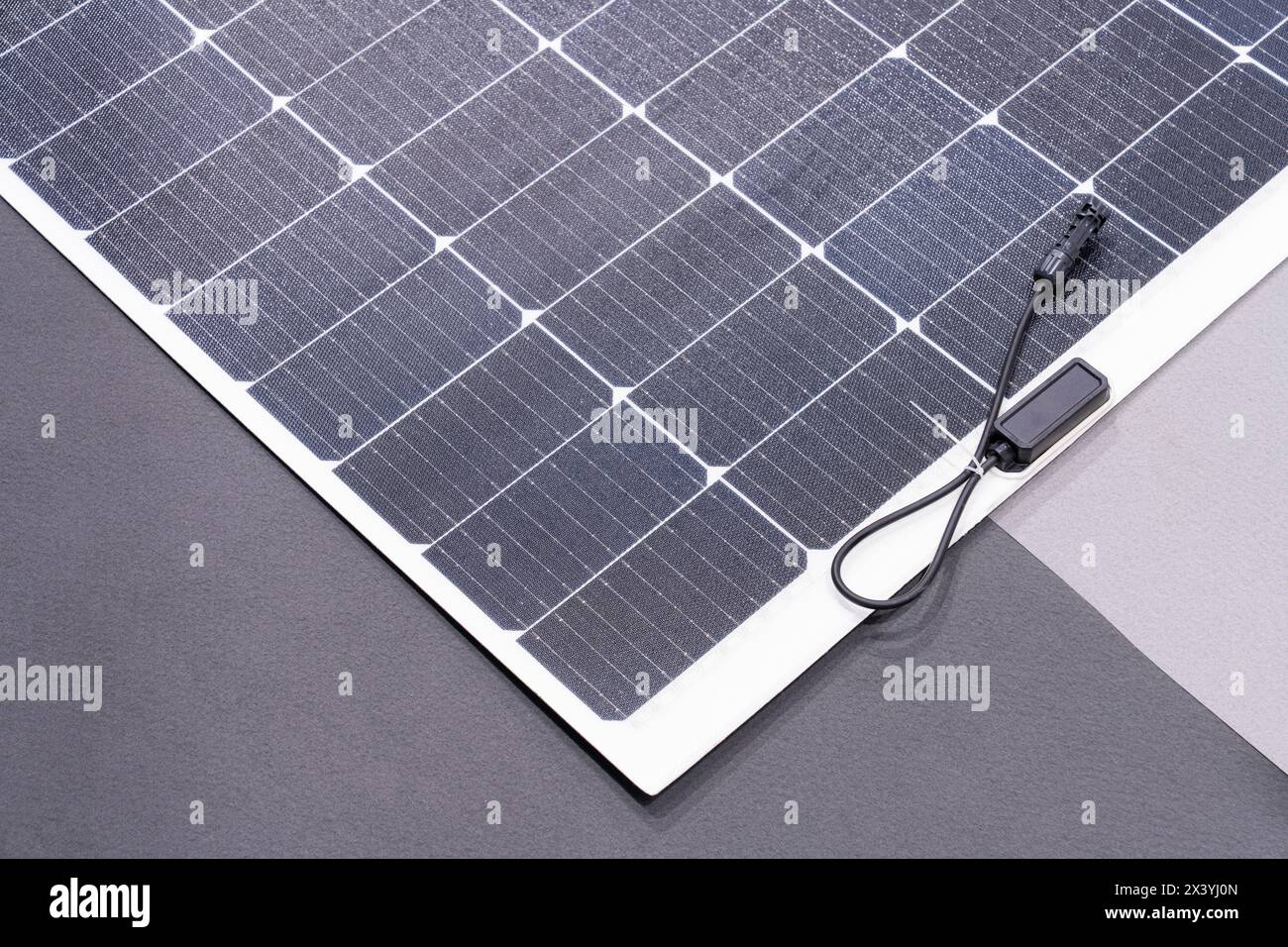 Thin flexible mobile solar panel with cable for connection Stock Photo ...