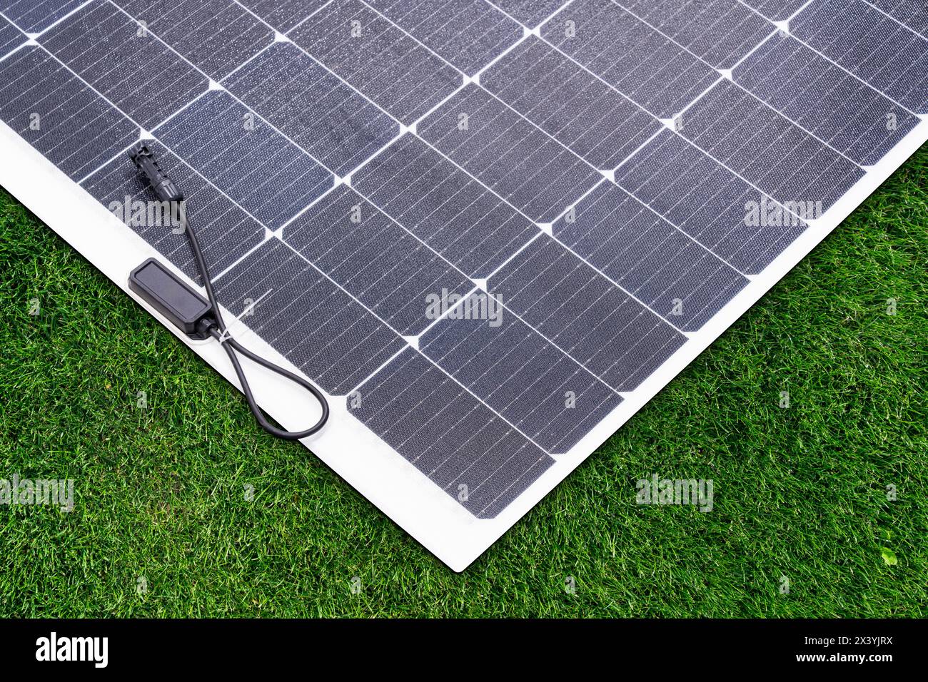Thin flexible mobile solar panel with cable for connection Stock Photo ...
