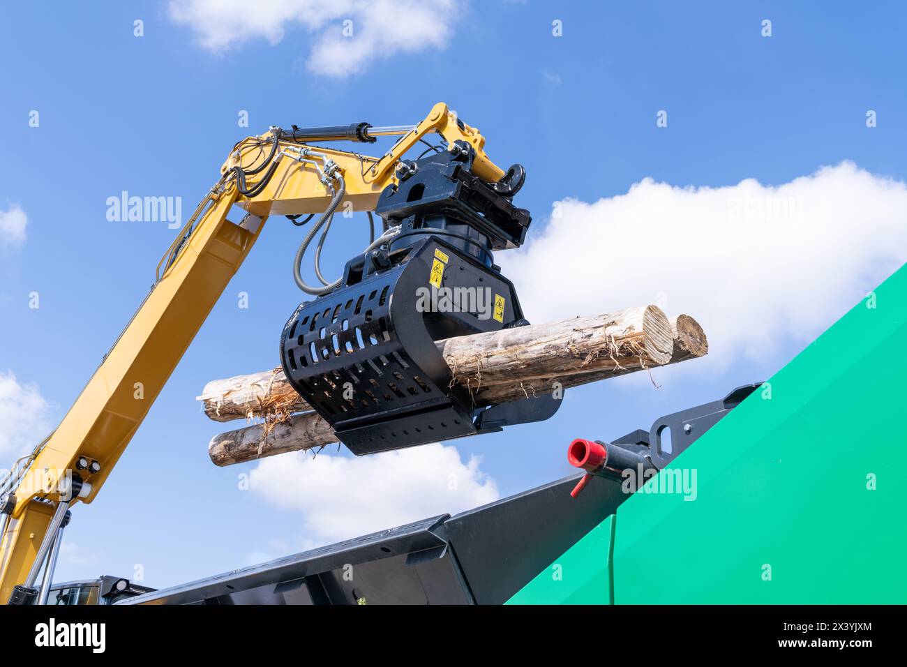 Loading of timber. Loader close up Stock Photo - Alamy