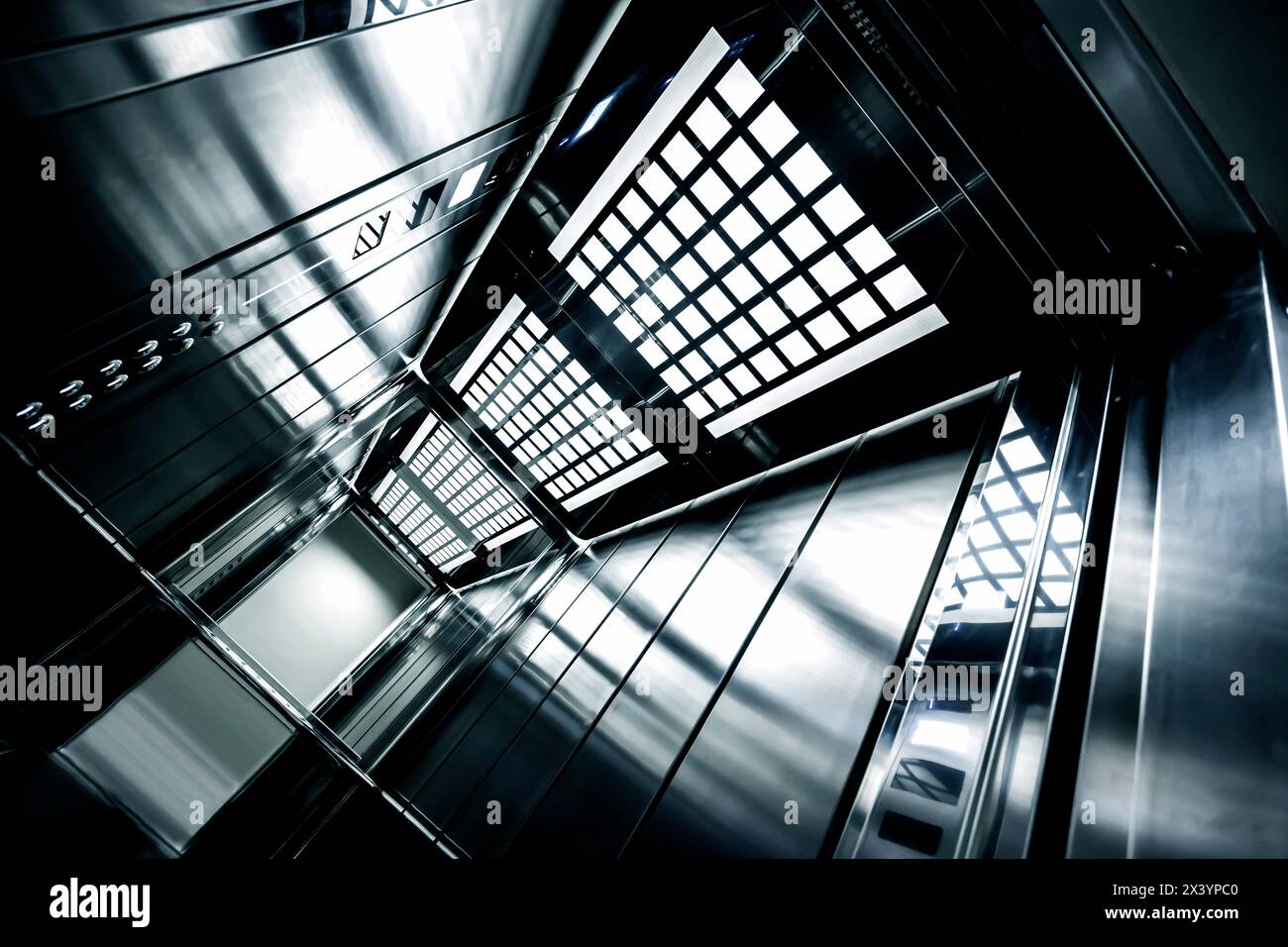 Modern steel metal elevator interior in an office building with ...