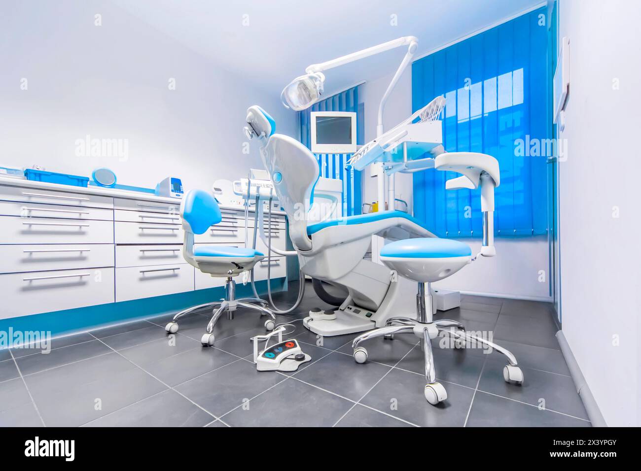 Dental clinic interior with modern dentistry equipment. Dental chairs ...