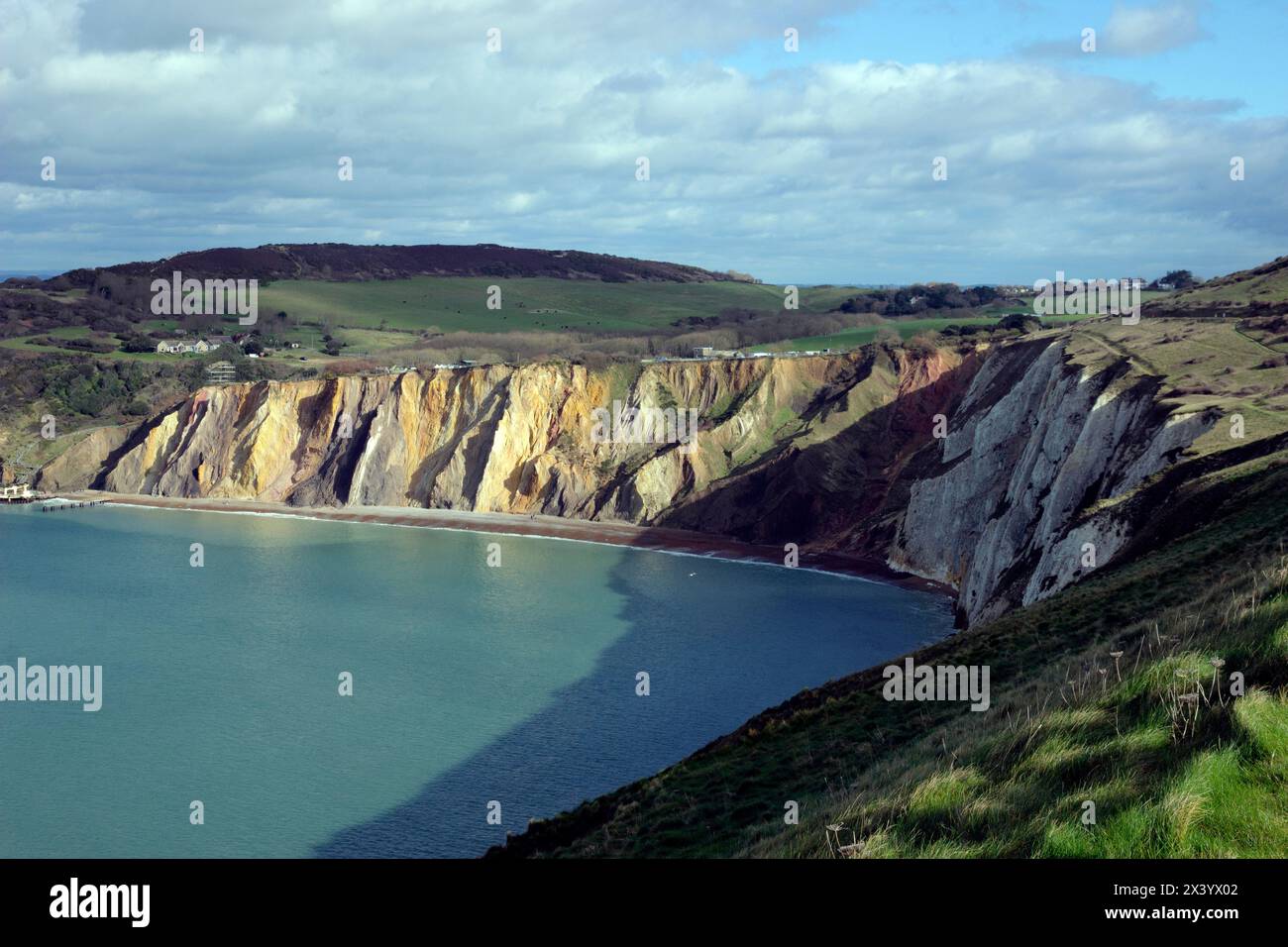 The multi-coloured sand cliffs of Alum Bay are a geological curiosity ...