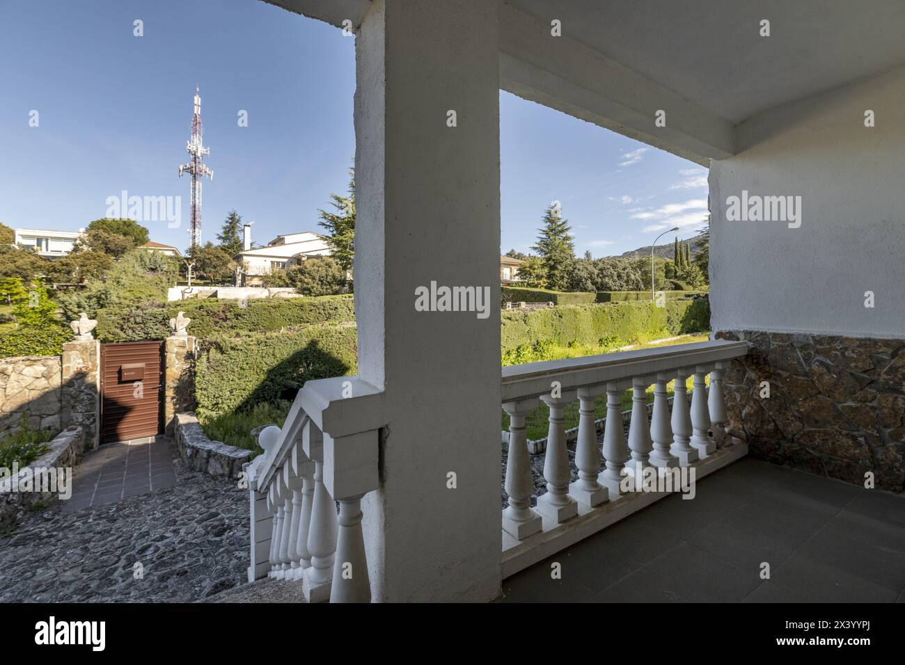 Access stairs to a single-family home built with white balustrades ...