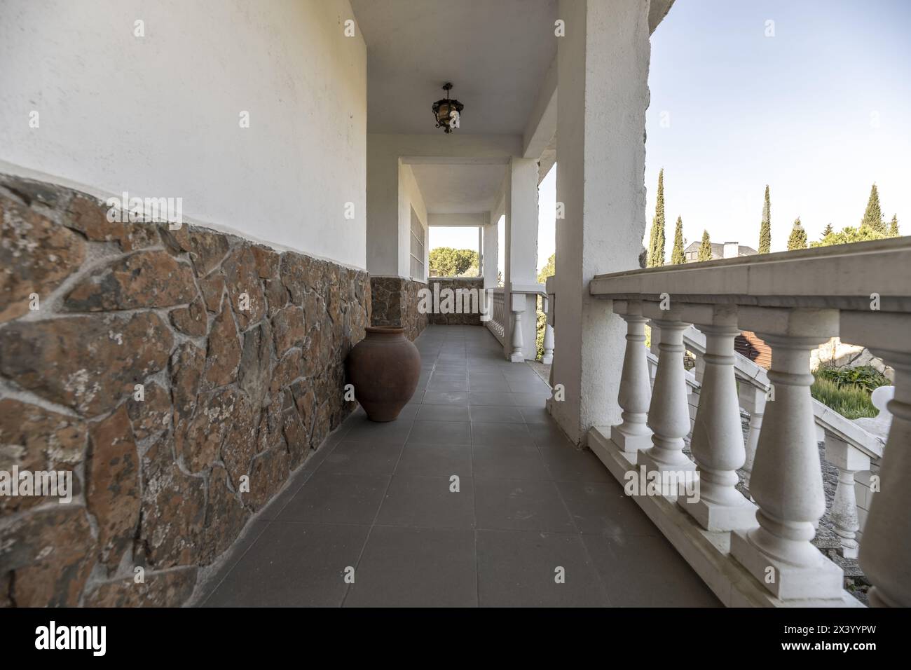 white balustrades of a long terrace outside terrace of a detached house ...