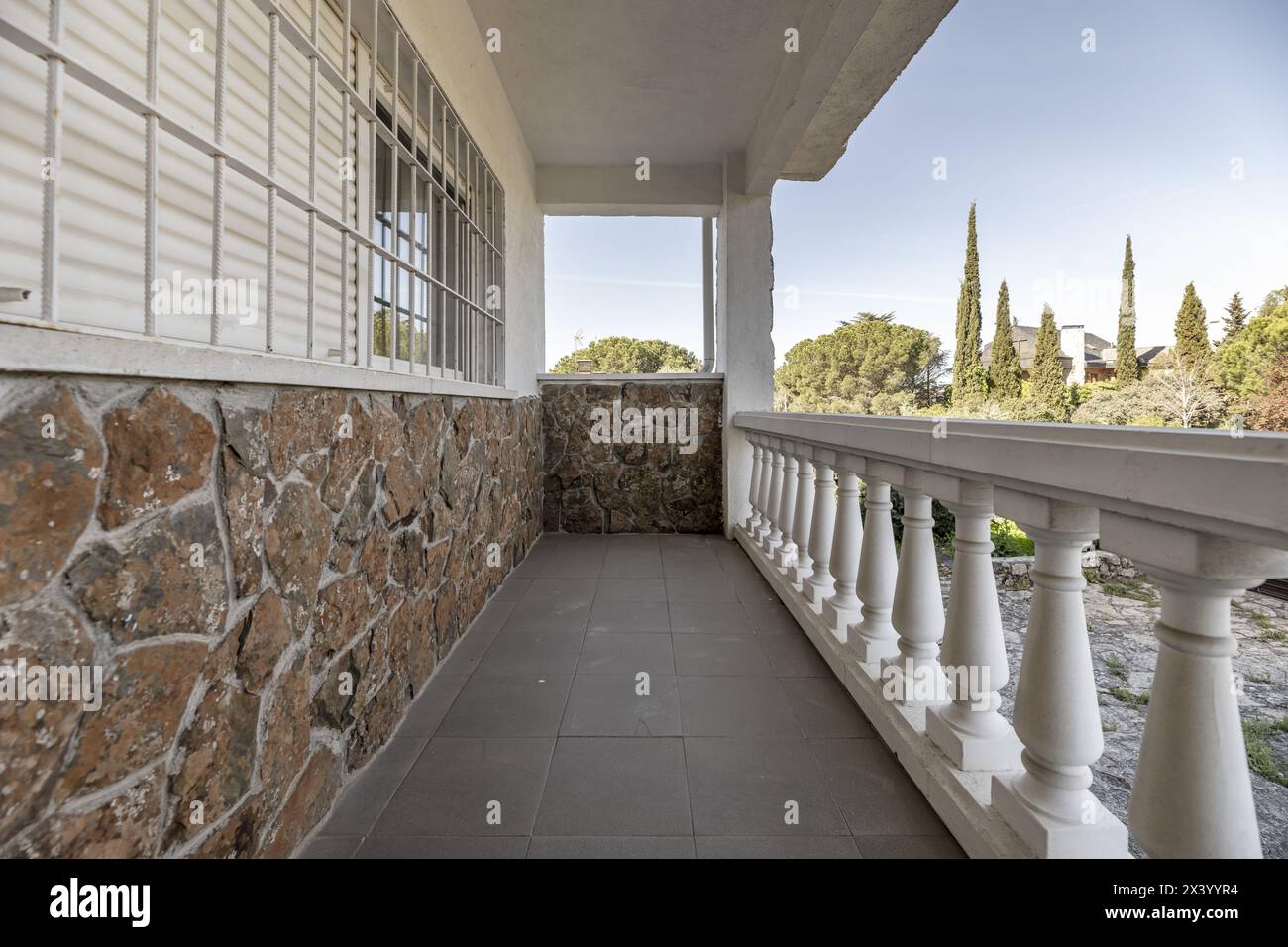 white balustrades of a long terrace outside terrace of a detached house ...