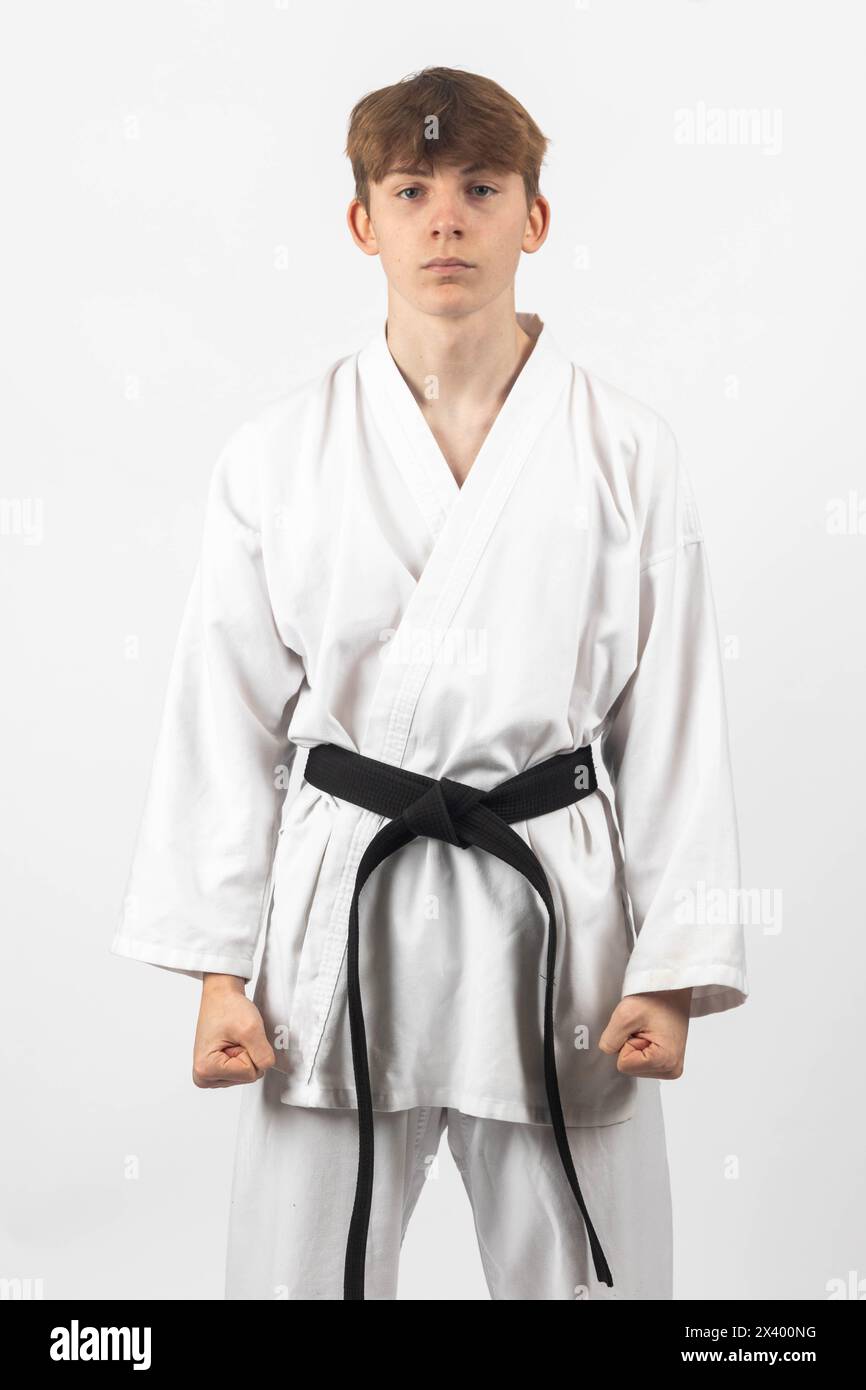 A 15 year old Karate Blackbelt boy, wearing A Gi standing in Hachiji dachi (Ready Stance Stock ...