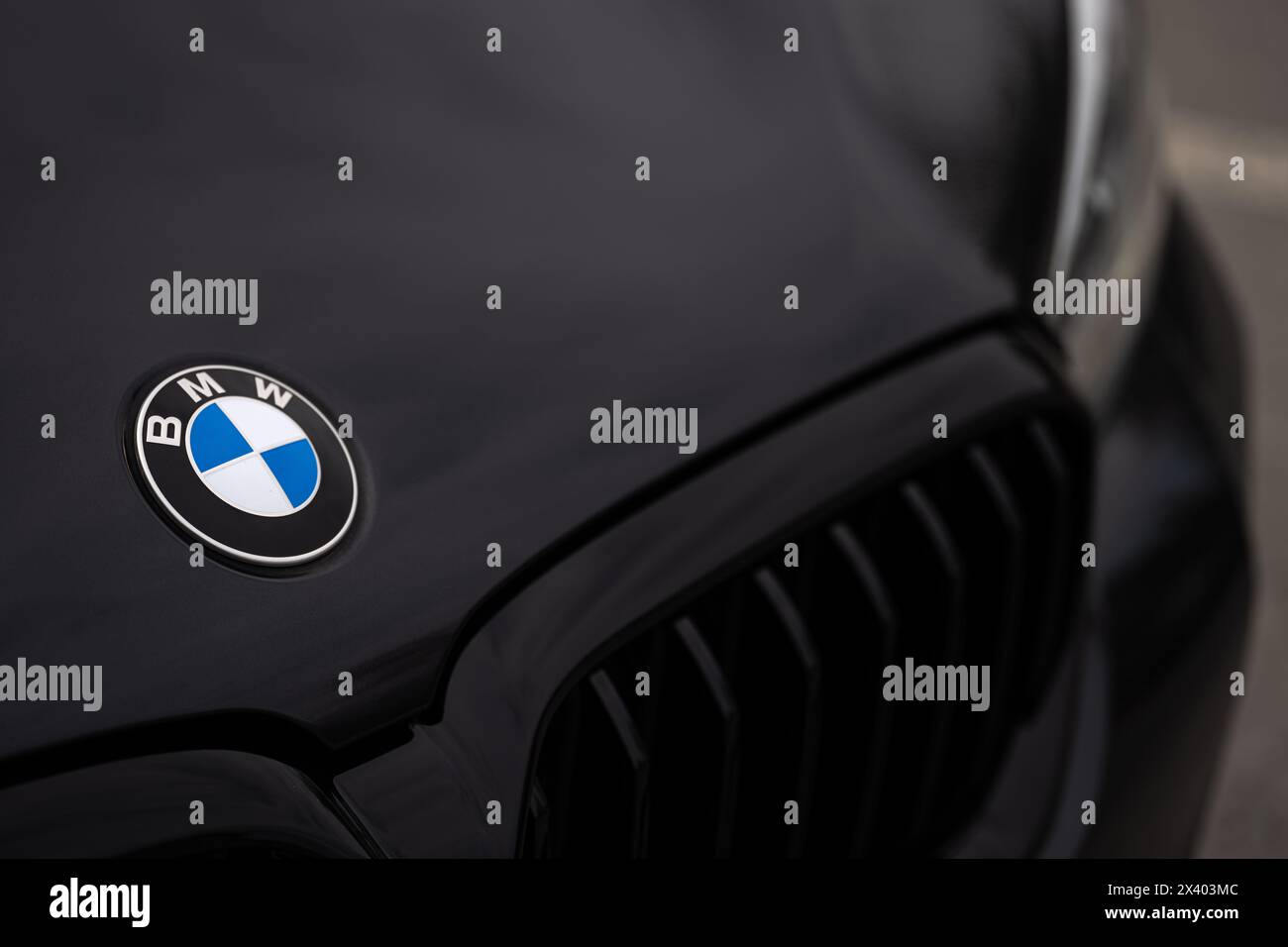 Closeup of BMW logo and grill on black car front. BMW 5-series Stock ...