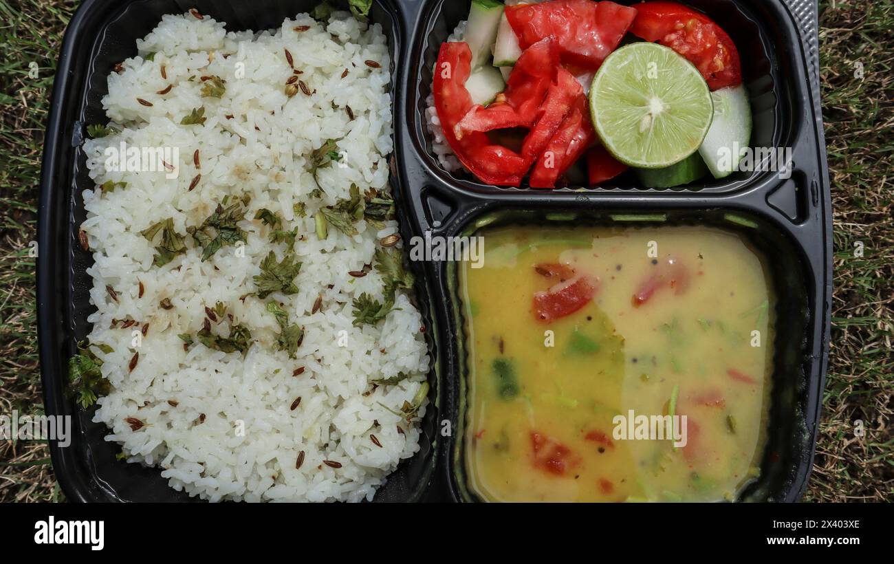 Jeera rice dal fry served with Salad in lunch platter Stock Photo - Alamy