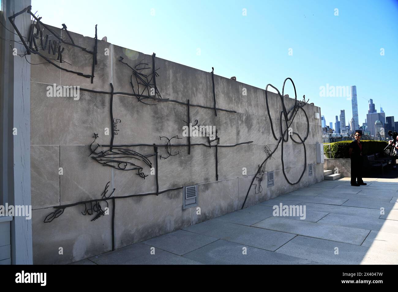 Guests tour the art installations on display at the press preview for ...