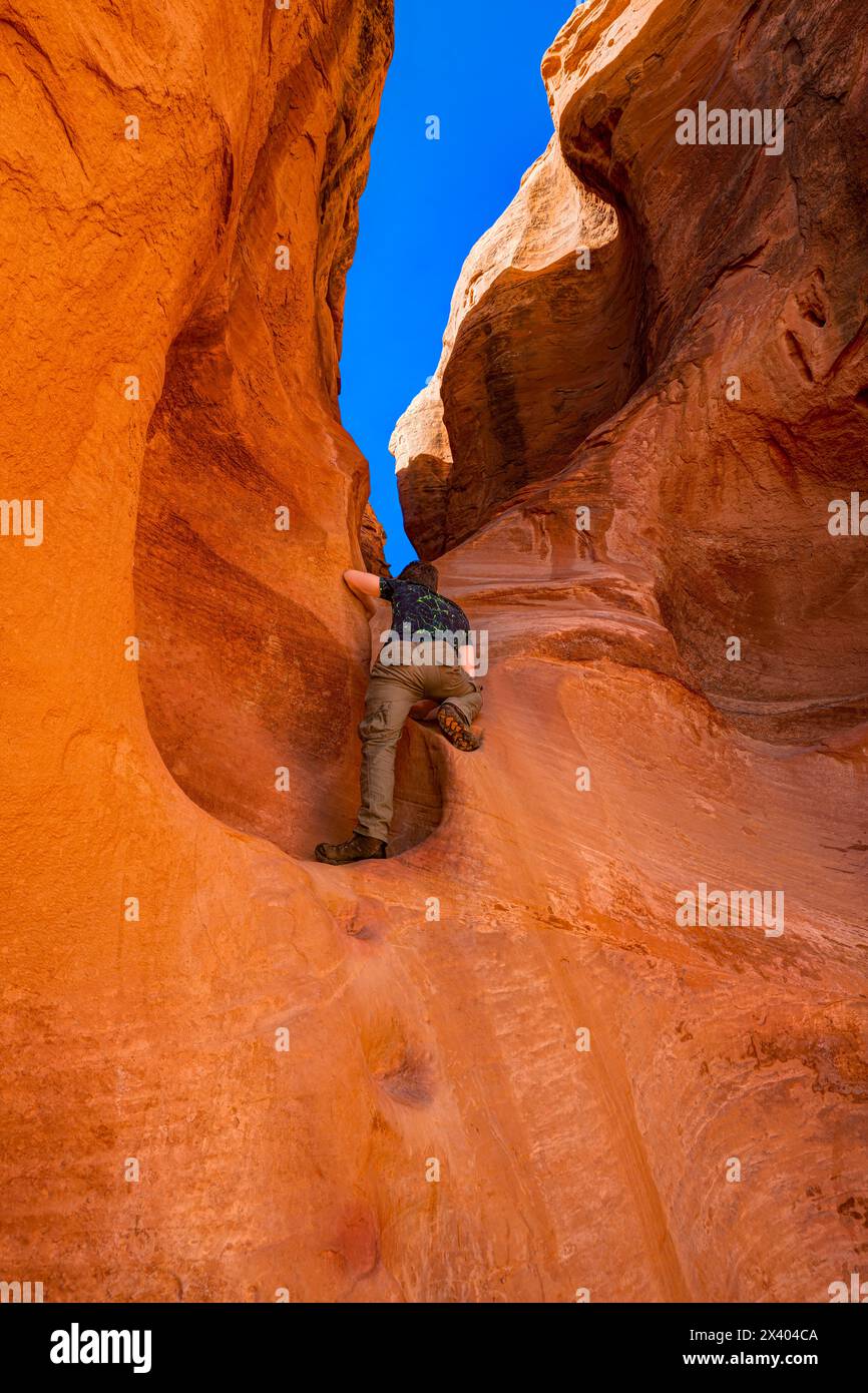 Man Climbing in Peek-a-boo Gulch. Big Hollow Wash, Grand Staircase ...