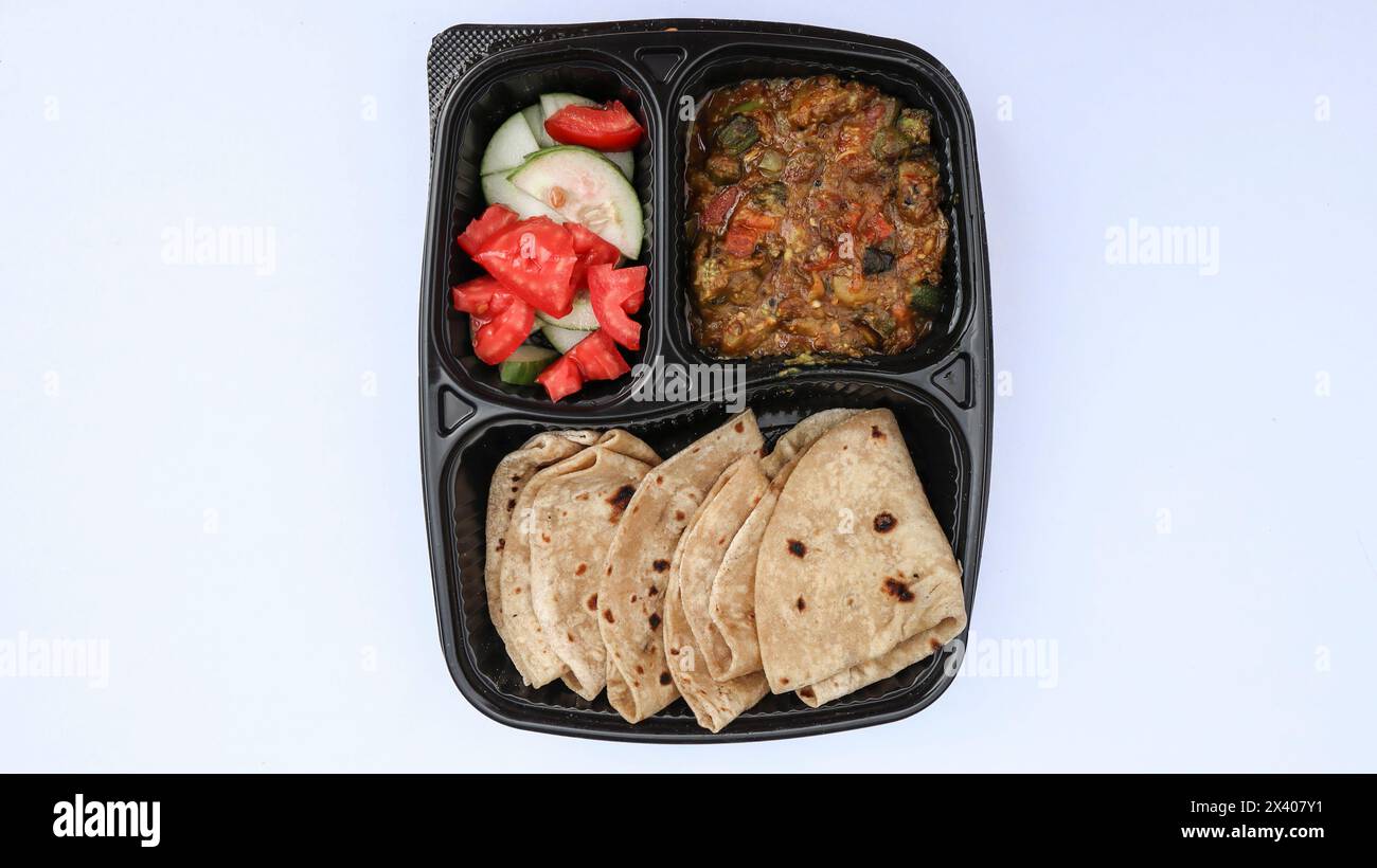 Simple and tasty Indian lunch box consisting of roti ans sabji. Sabzi ...