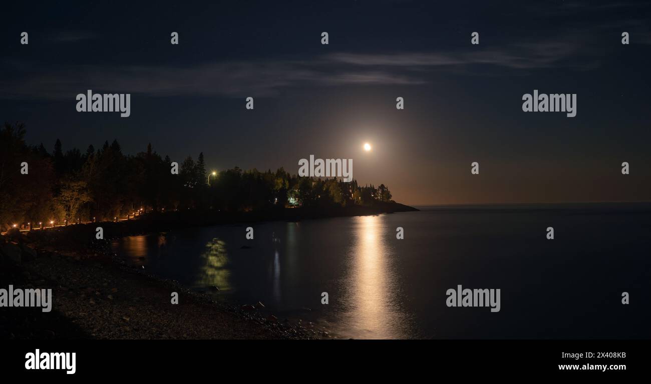 Night view of north shore of Lake Superior with reflection of hazy moon ...