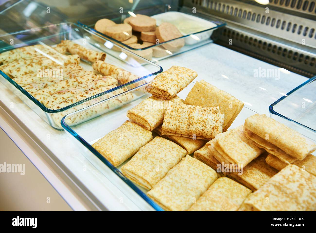 Stuffed pancakes on a shop window Stock Photo - Alamy