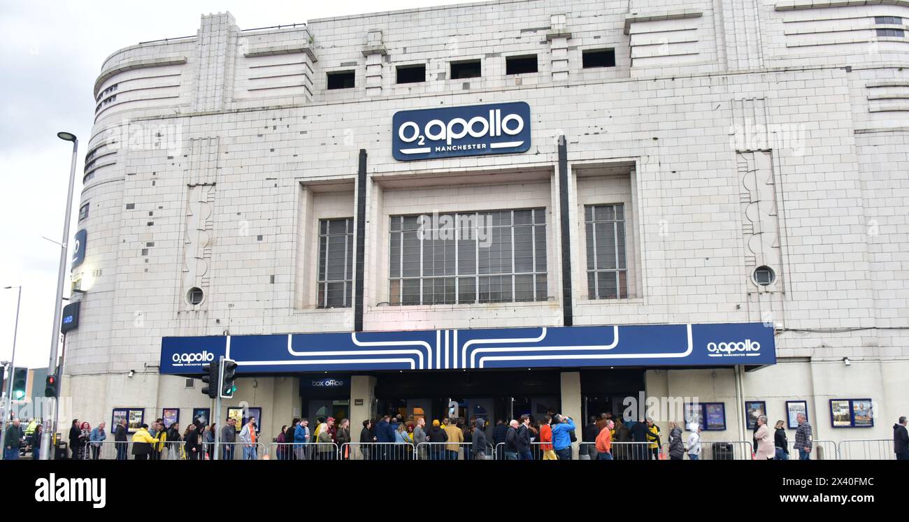 Audience members queue to enter the O2 Apollo venue in Manchester UK on ...