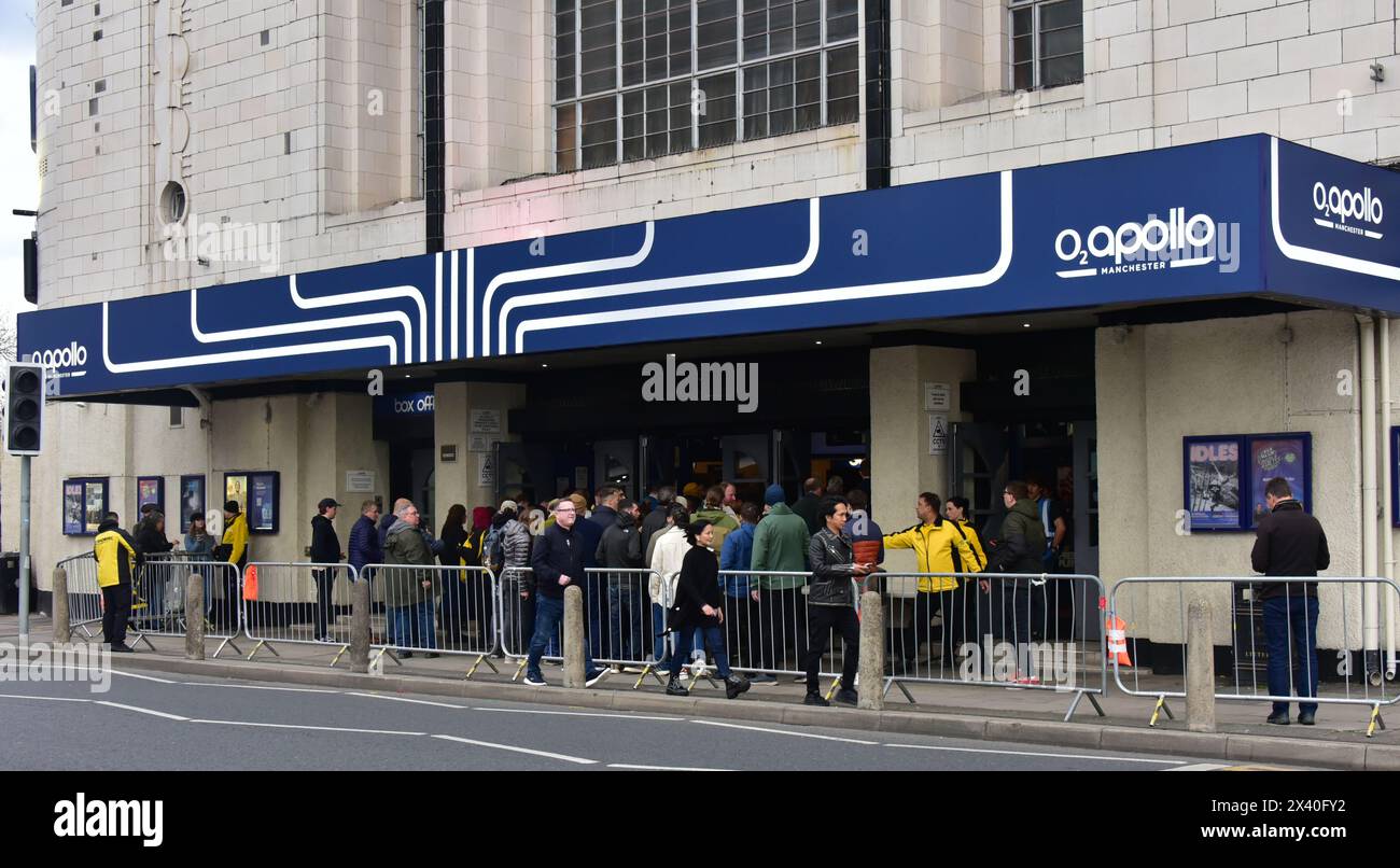 Audience members queue to enter the O2 Apollo venue in Manchester UK on ...