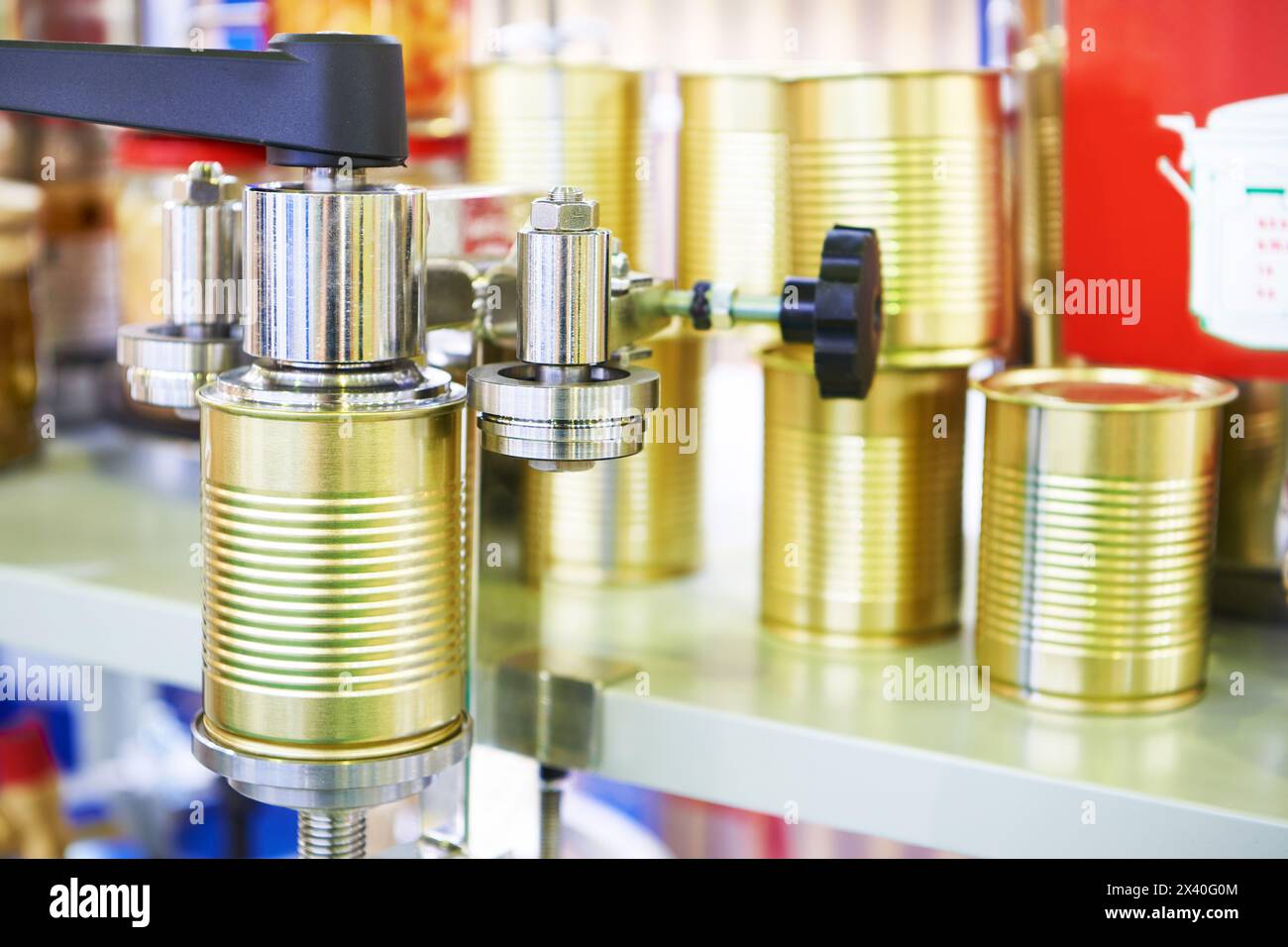 Automatic seamer for metal cans at the exhibition Stock Photo - Alamy