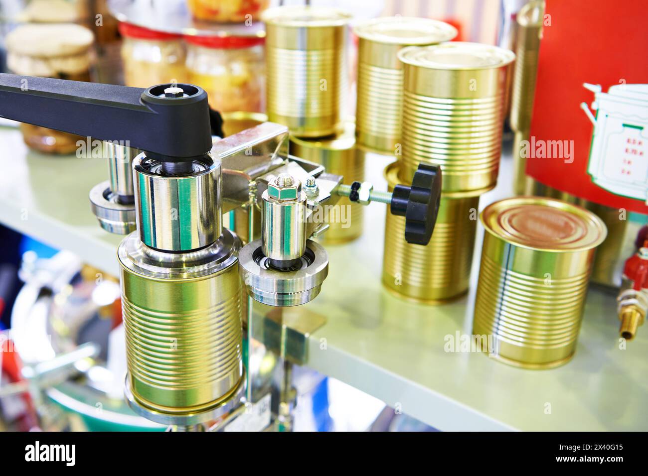 Automatic seamer for metal cans at the exhibition Stock Photo - Alamy